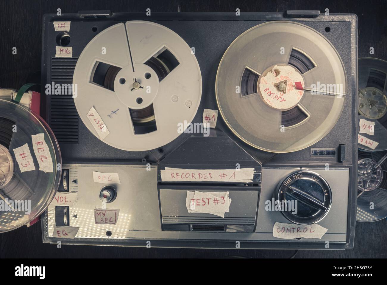 Vintage reel audio recorder and tape rolls. Audio reel player. Retro ...