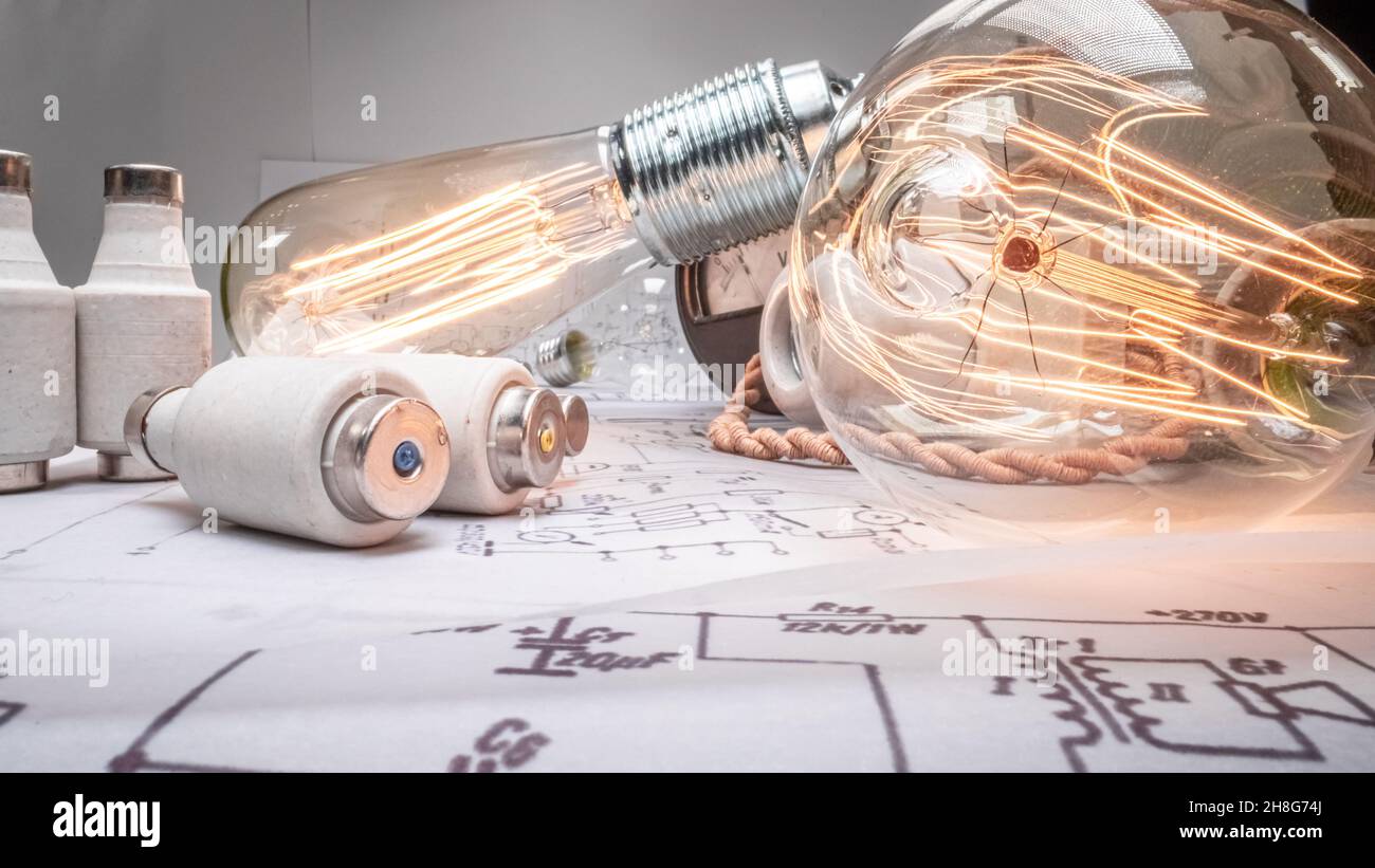 Edison light bulb with cables, fuses, diagrams. Old fashioned crafts ...