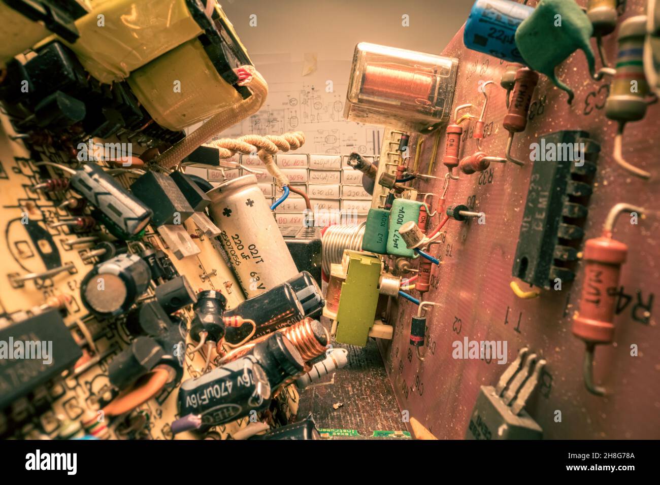 Retro electronics workshop. with parts, soldering iron and voltmeter ...