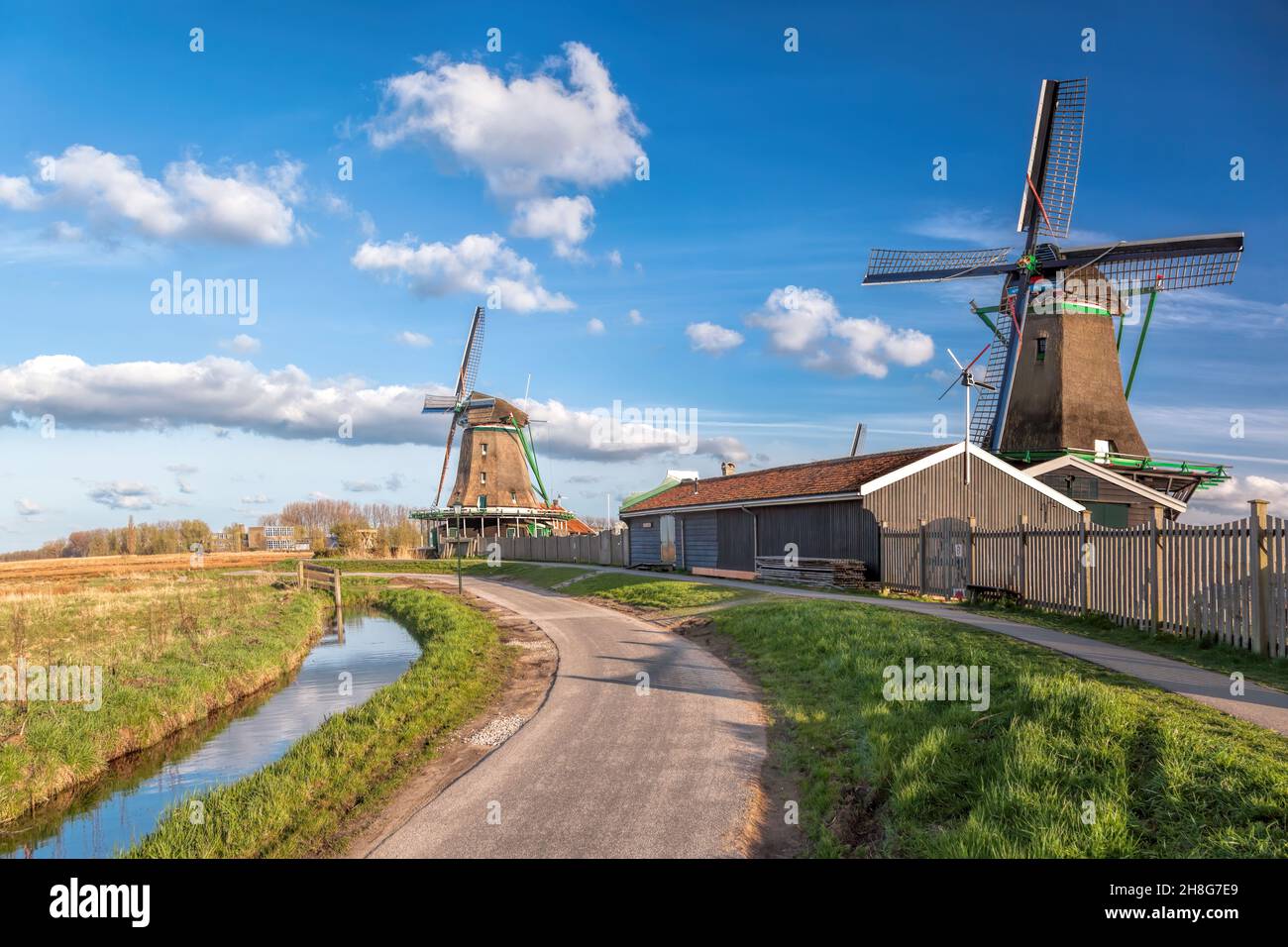 Traditional Dutch windmills against blue sky in Zaanse Schans ...