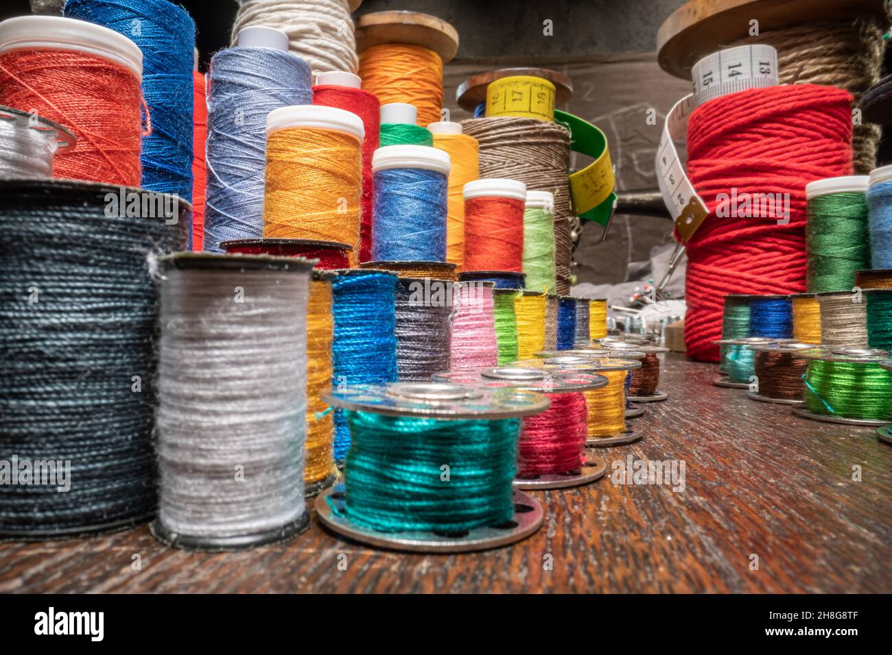 Small tailor workshop sewing traditional individual clothes. Vintage ...