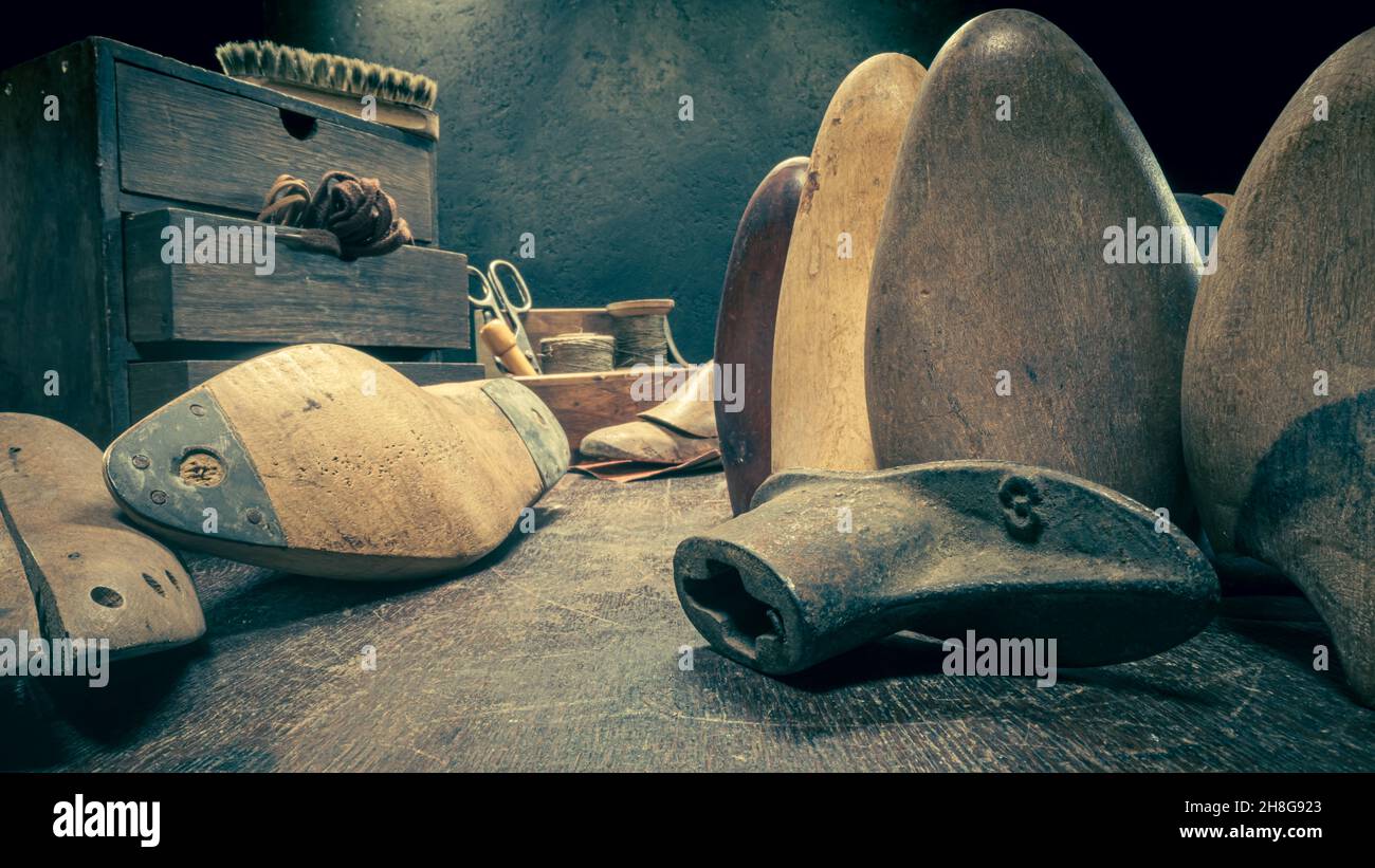 Traditional shoemaker workshop with tools, rules, leather and strap ...