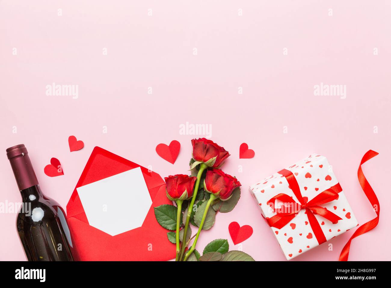 Valentine's day composition with red wine, rose flower and gift box on ...