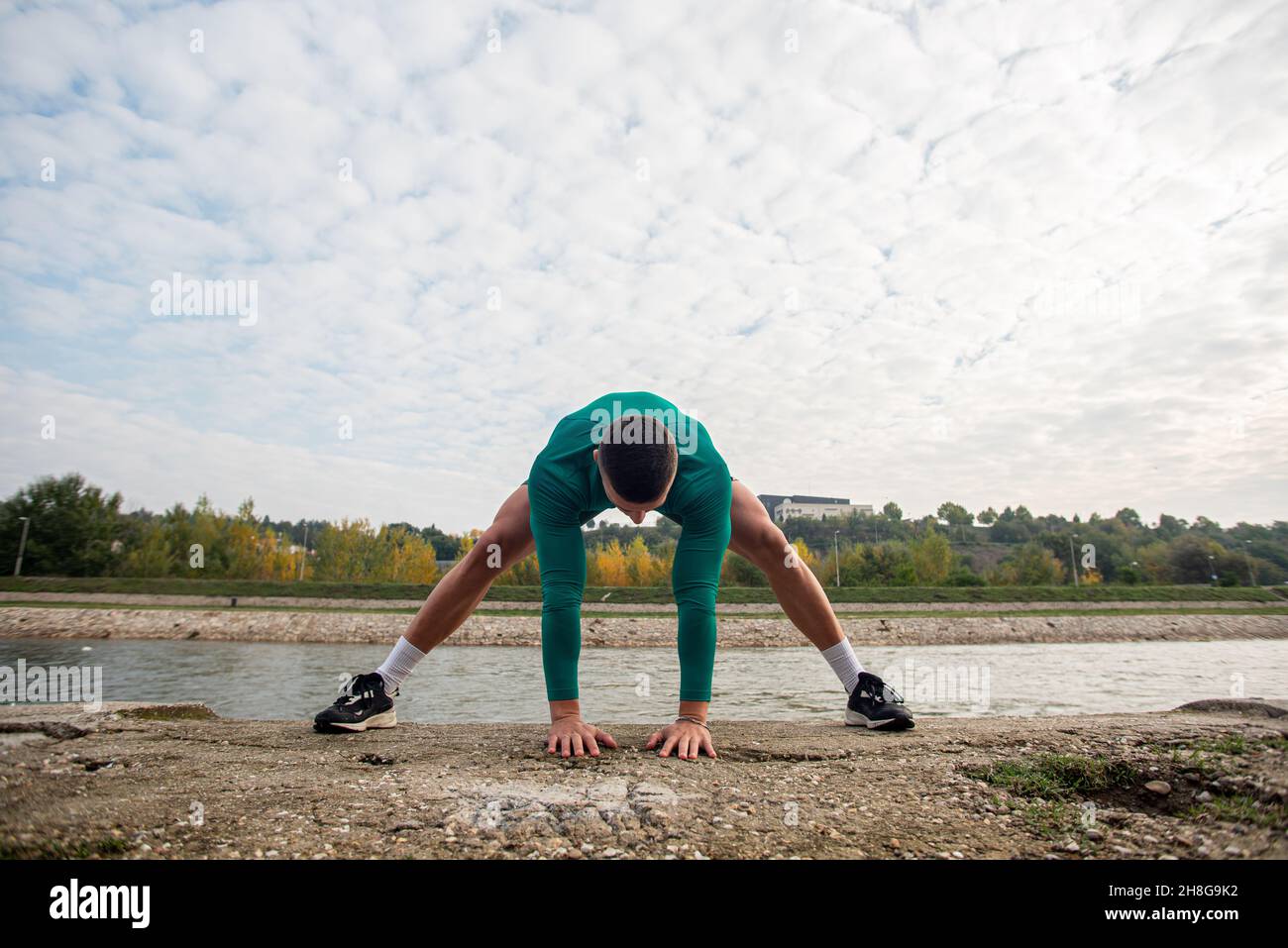 Man stretching by the riverside hi-res stock photography and images - Alamy