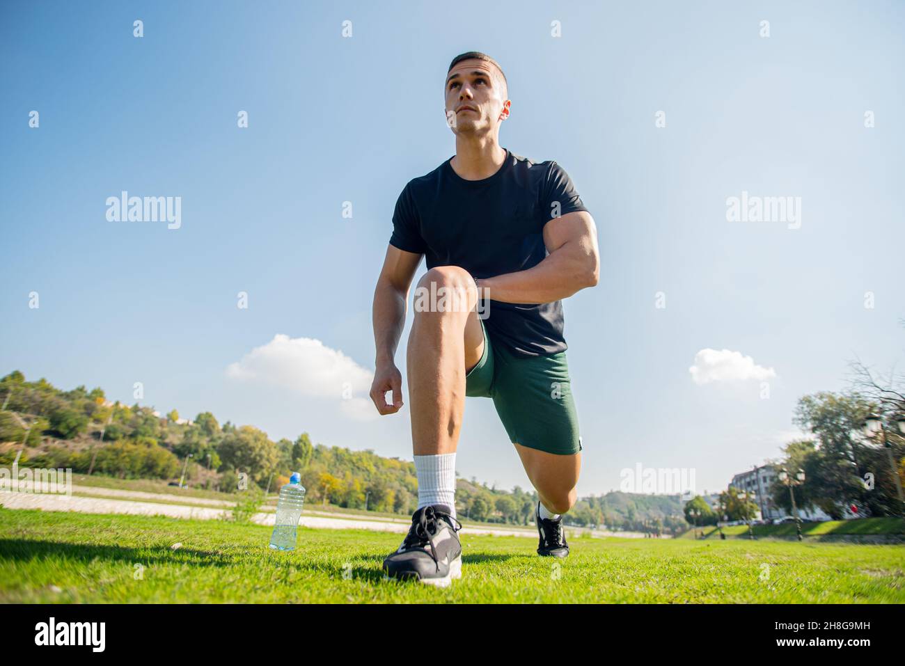 Man stretching by the riverside hi-res stock photography and images - Alamy