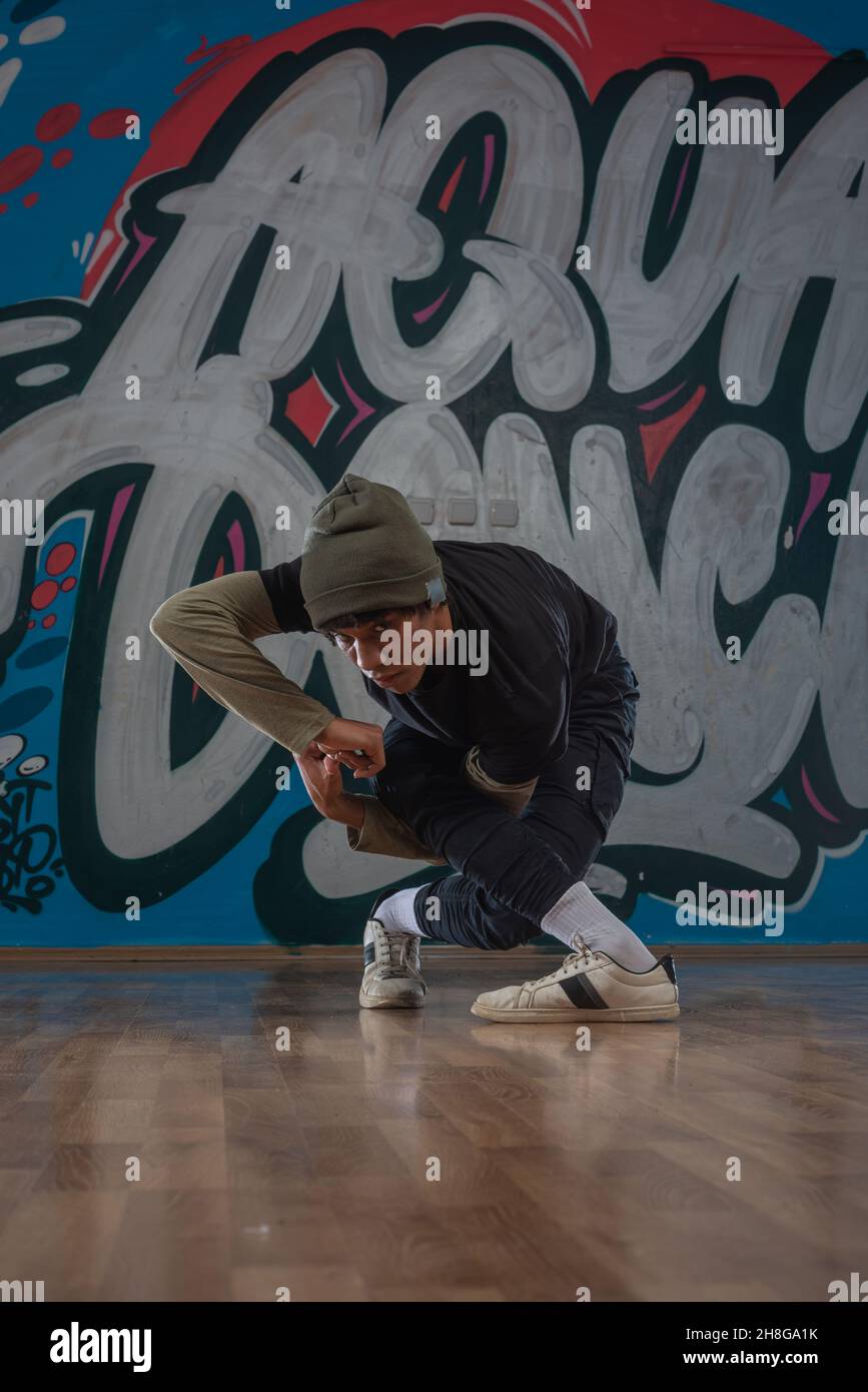 Modern rapper dancing in garage. Urban lifestyle, hip hop Stock Photo ...