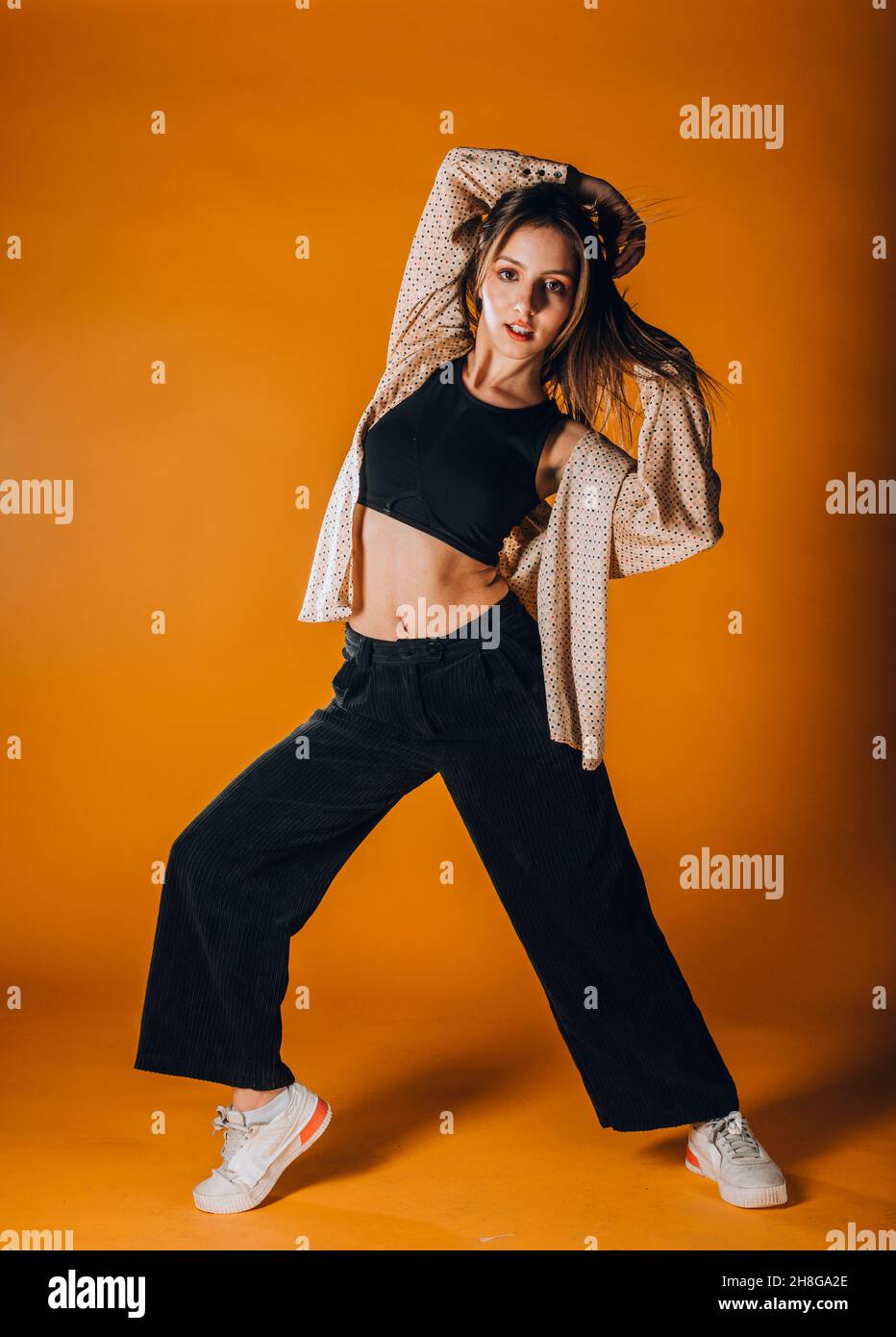 Dance moves performed by an acrobatic flexible female dancer Stock ...