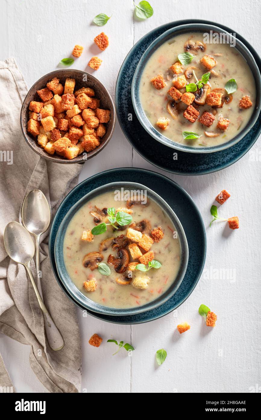 Homemade mushrooms soup as aromatic and hot starter. Champignons soup ...