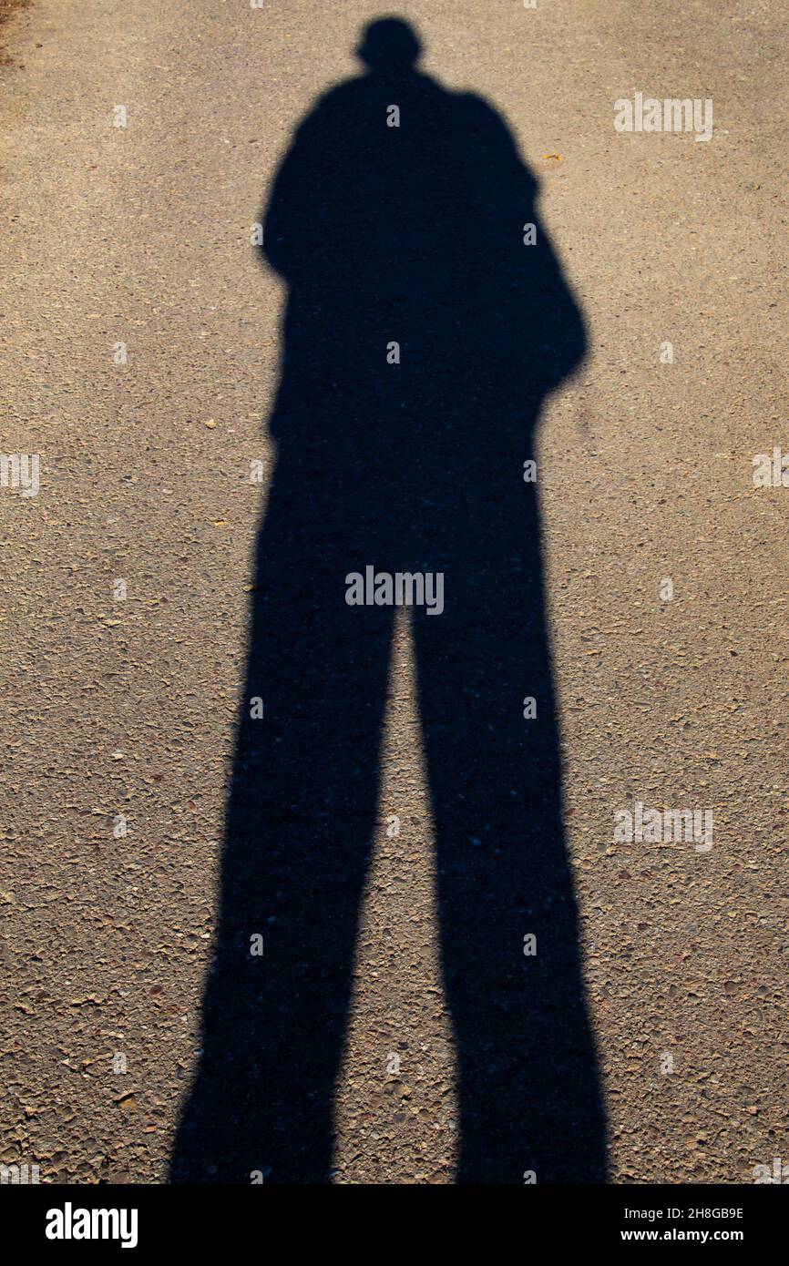 Human shadow on street hi-res stock photography and images - Alamy