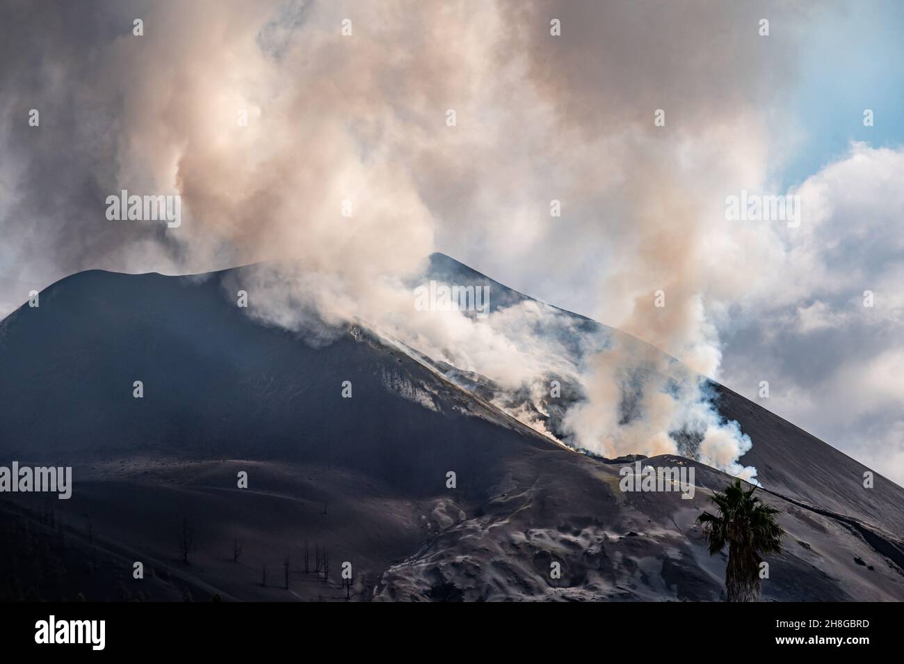 Volcano erupting in mountains in daytime Stock Photo - Alamy