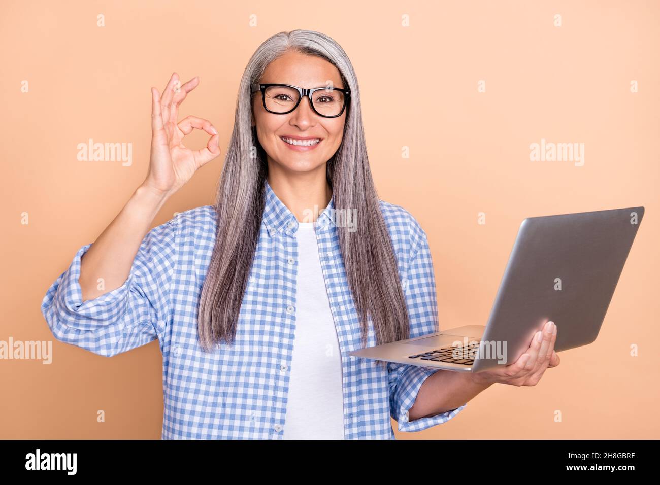 Photo of sweet shiny retired woman wear plaid shirt spectacles showing ...