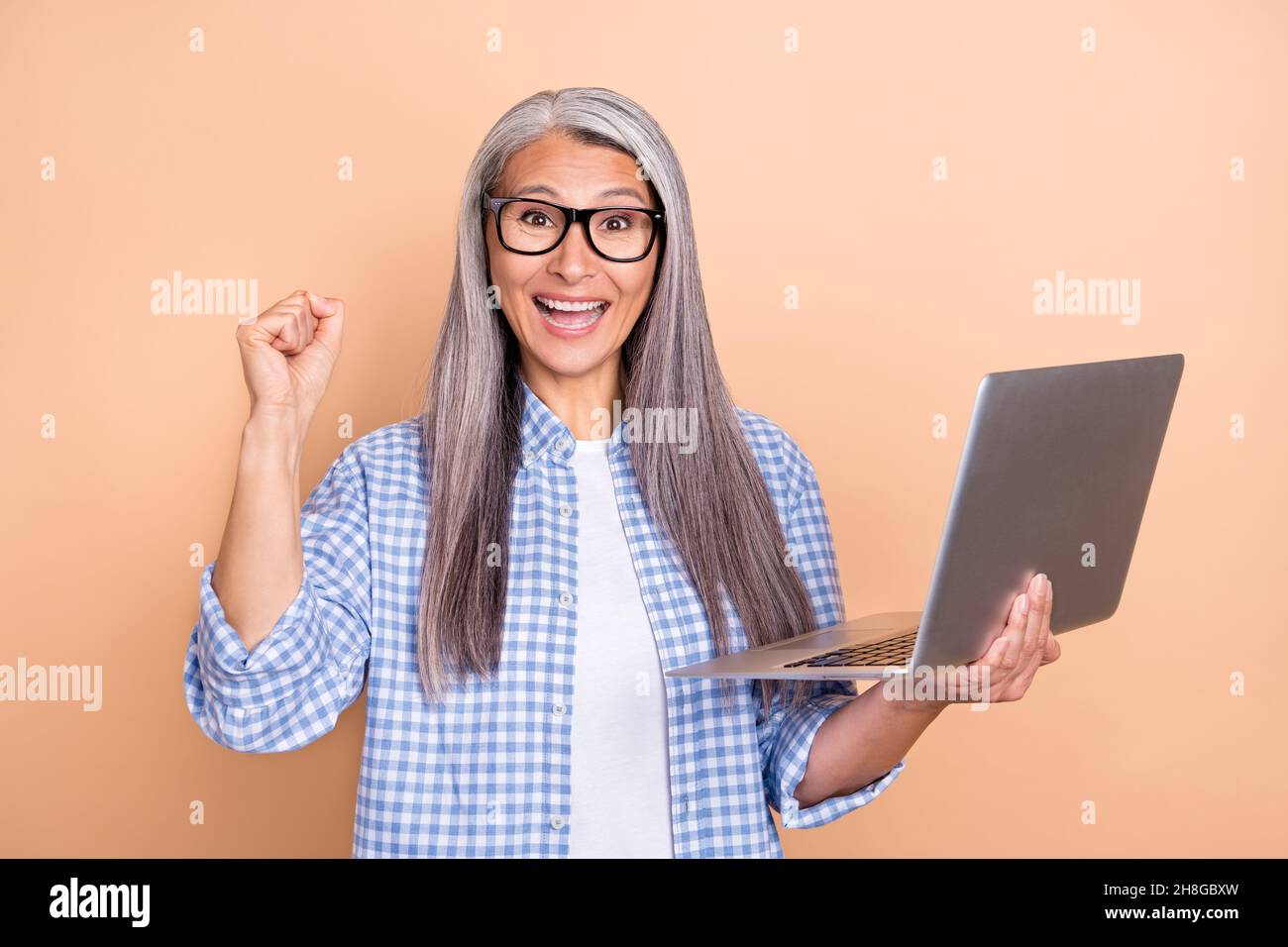 Photo of cute lucky retired woman wear plaid shirt spectacles rising ...