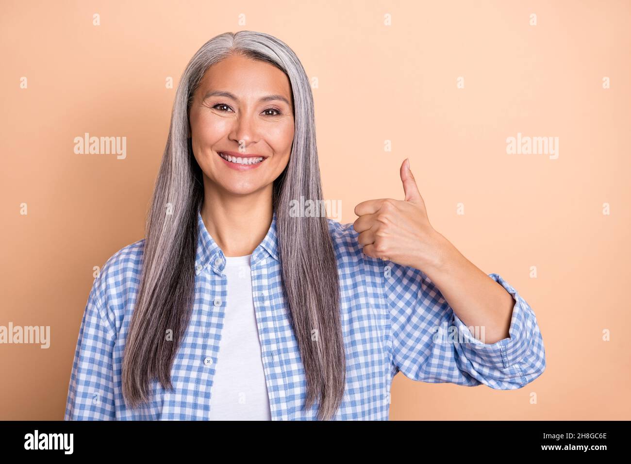 Photo of confident charming lady pensioner dressed checkered shirt ...