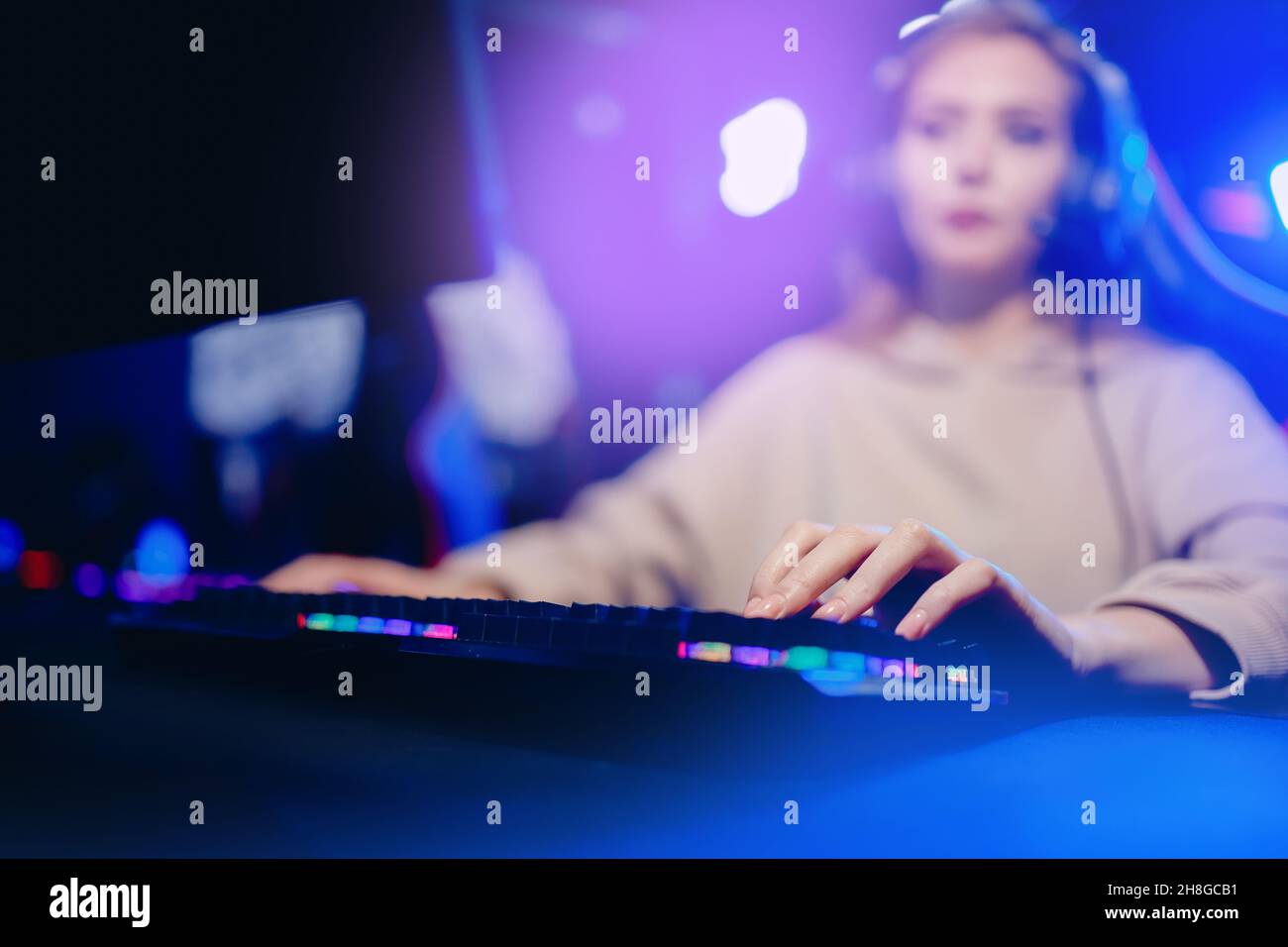 Young woman streamer play on online video game tournament, neon color ...