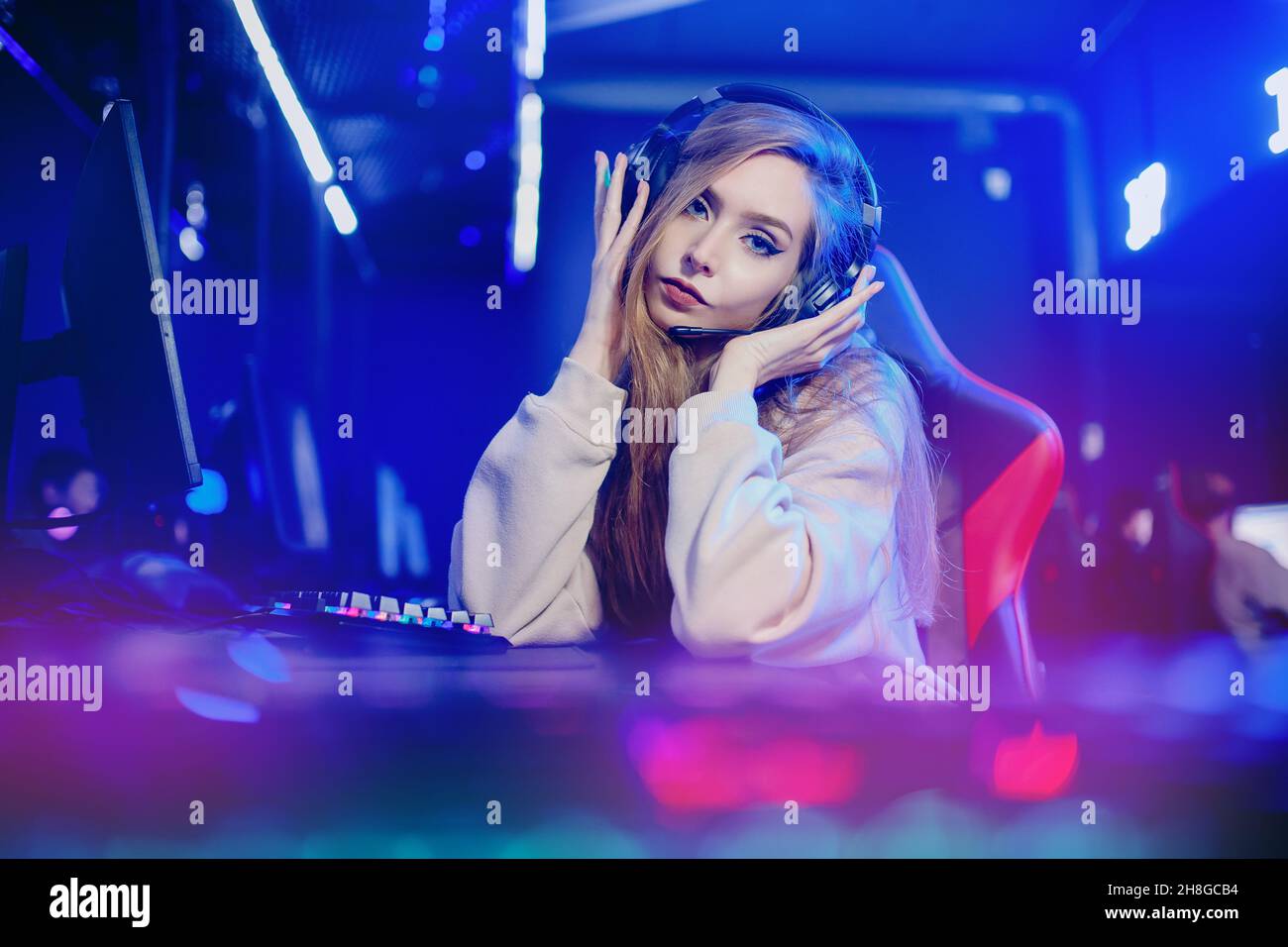 Professional cyber video gamer woman in studio room with personal ...