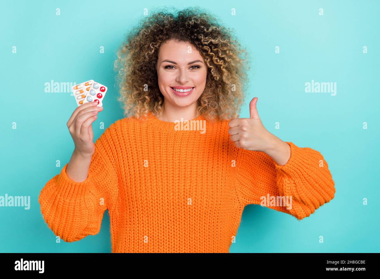 Photo of reliable lady hold vitamins raise thumb up approve solution ...