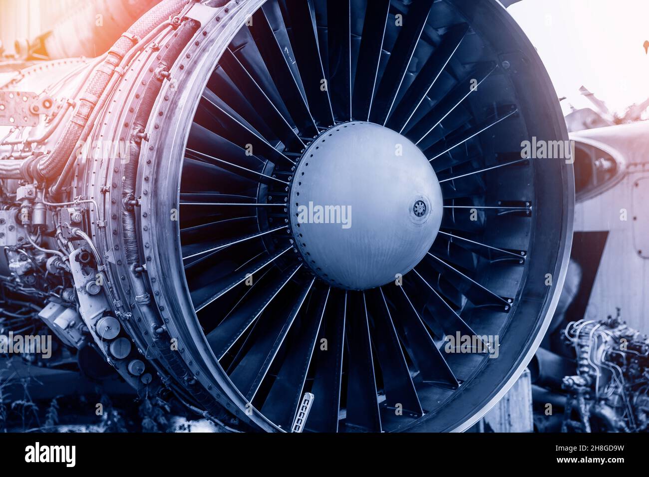 Closeup detail of turbine airplane engine blades, toning blue color ...