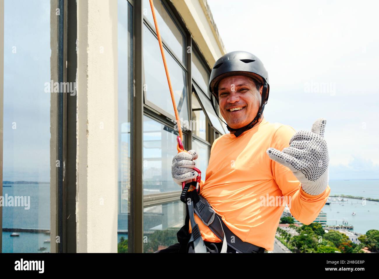 By rappelling down building hi-res stock photography and images - Alamy