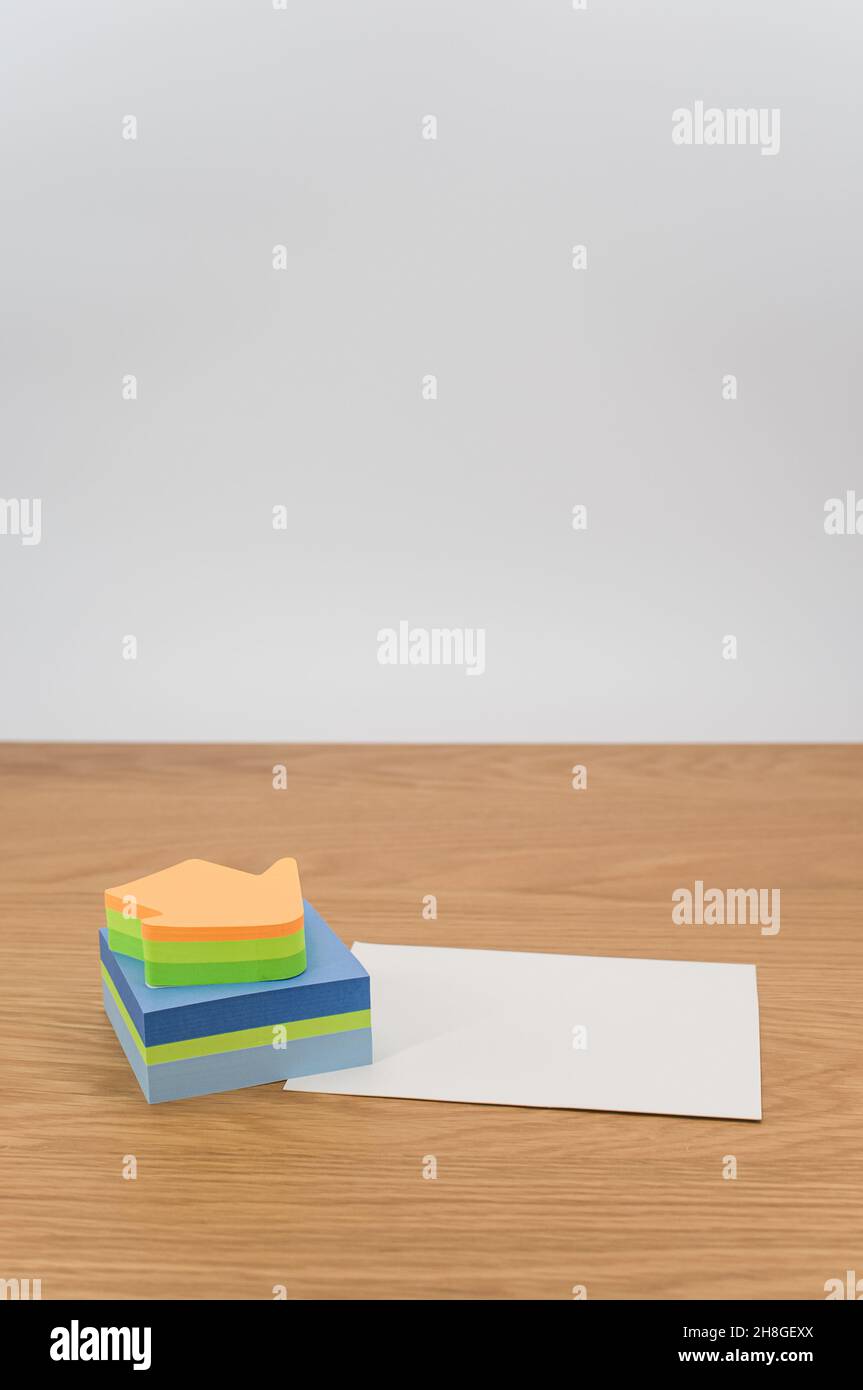 blank and colorful sticky note sheets on a wooden worktop background ...