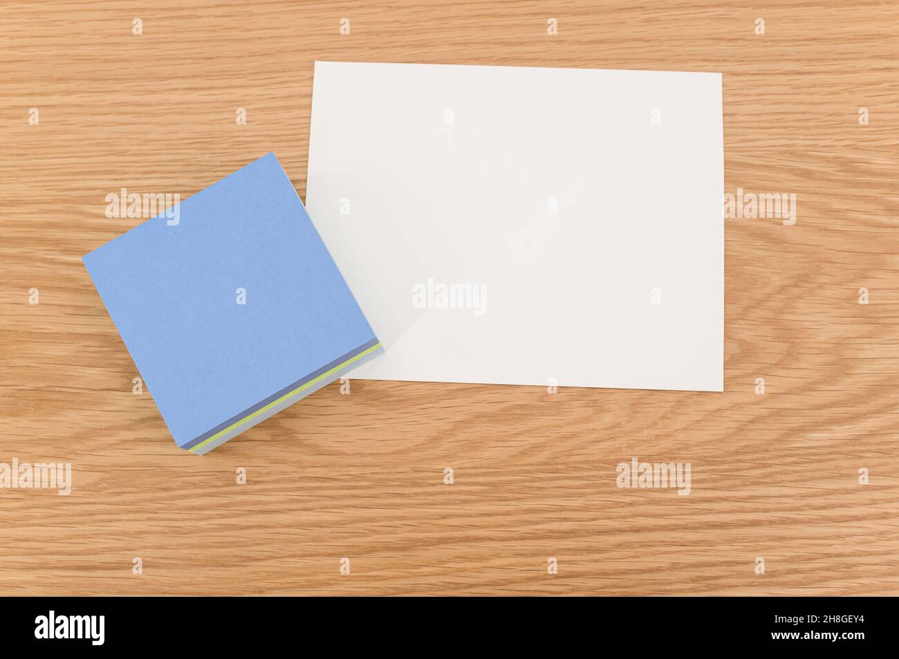 blank and colorful sticky note sheets on a wooden worktop background ...