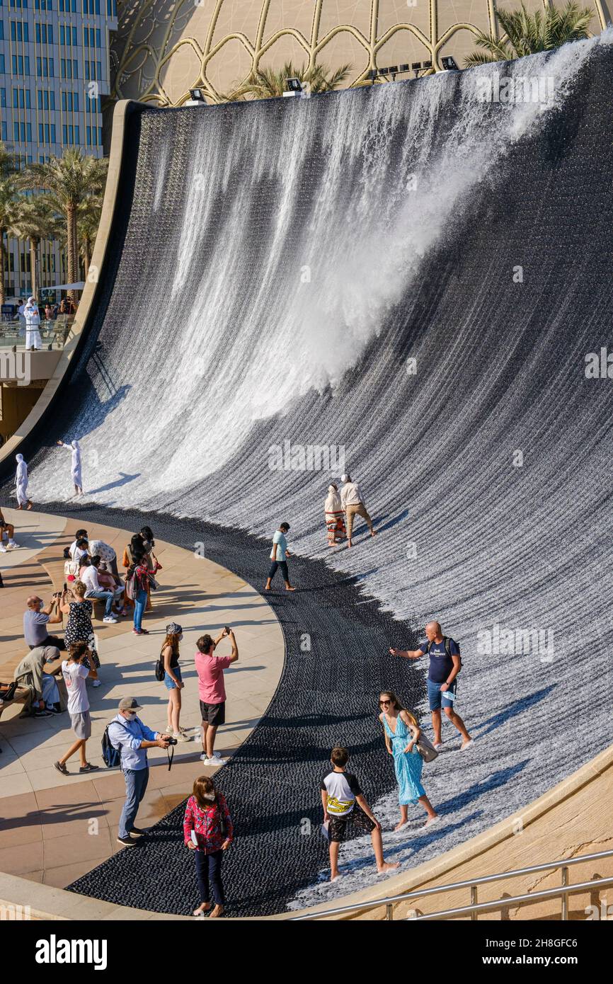 Visitors enjoying the unique water feature at Expo 2020, Dubai Stock ...