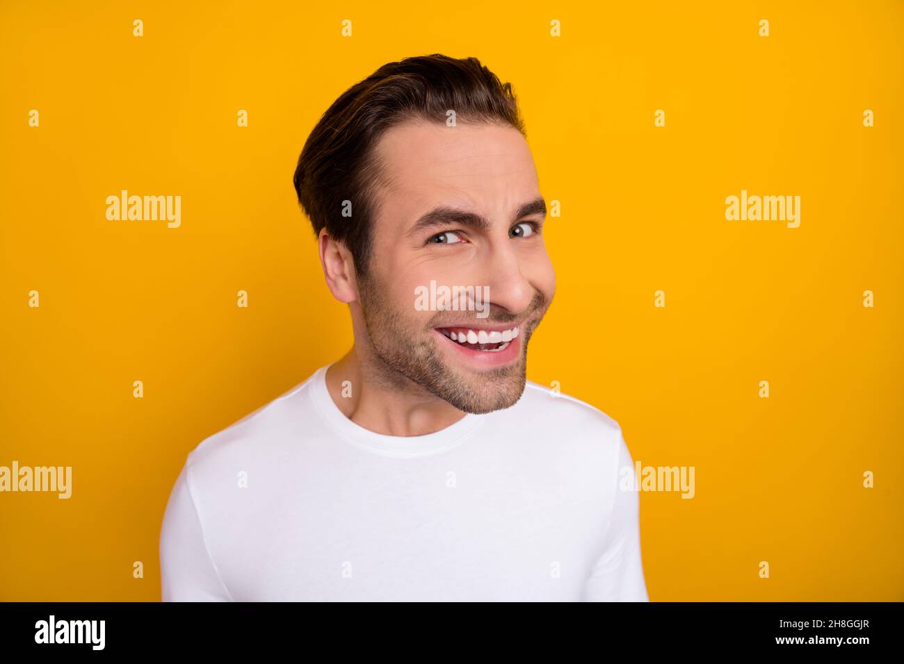 Photo of young guy good mood consider watch creative questioned ...