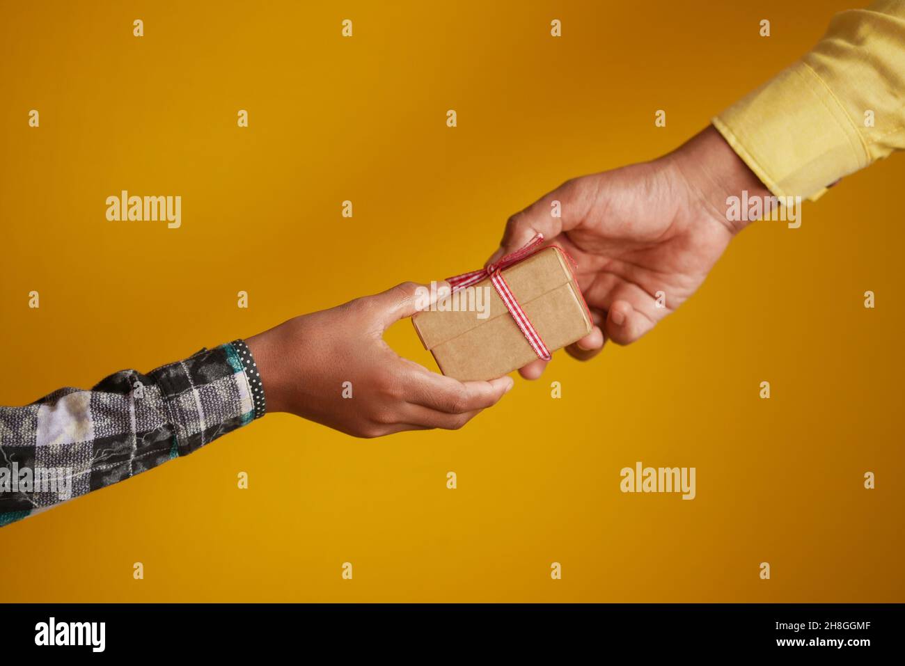 men hand giving homemade gift box Stock Photo - Alamy