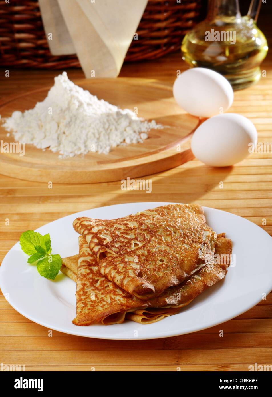 French style crepes with eggs and flour at background Stock Photo - Alamy