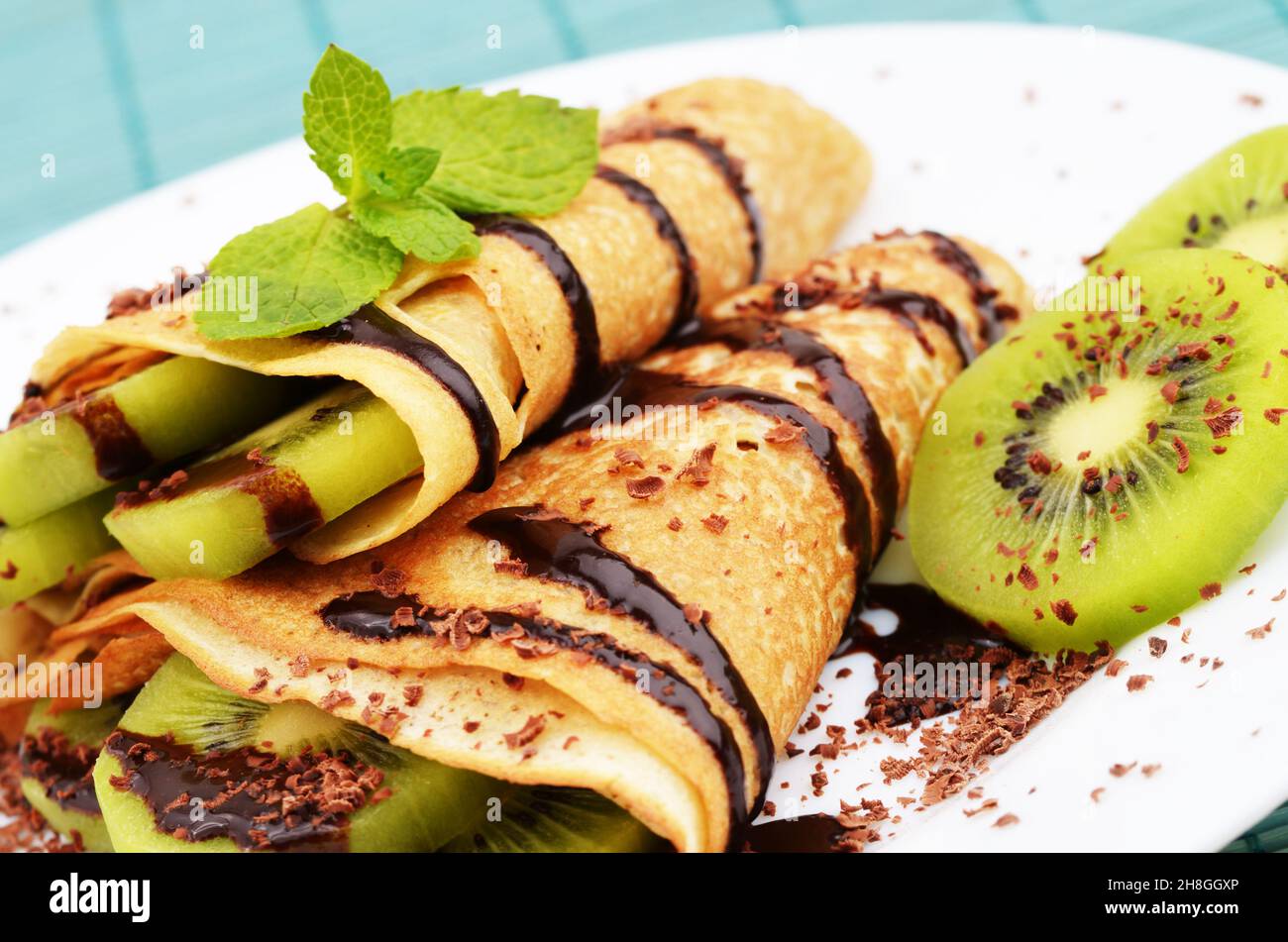 French style crepes with kiwi and chocolate syrup Stock Photo - Alamy