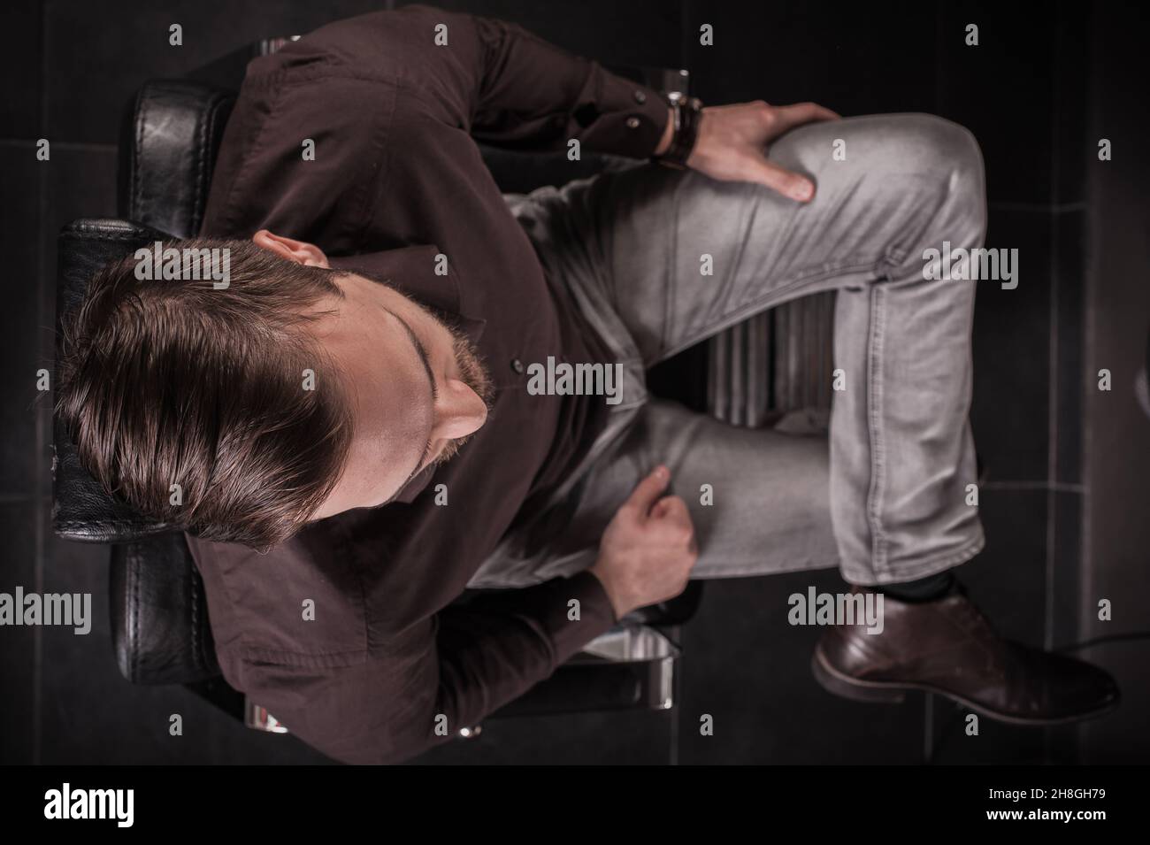 Top view of the man in the chair for a haircut in hair salon or barber ...