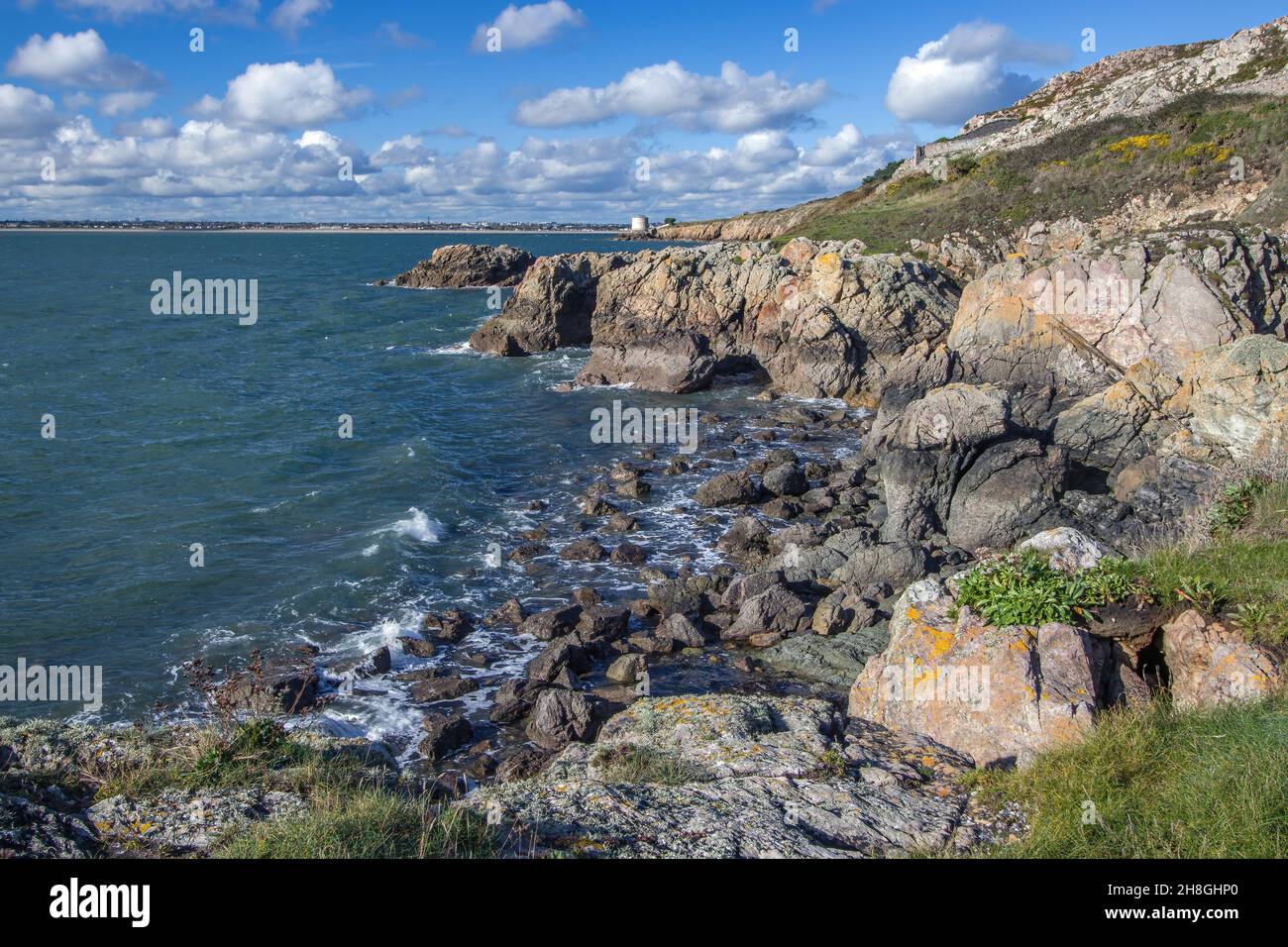 The Peninsula of Howth Head in sunny and cloudy day, hidden bay ...