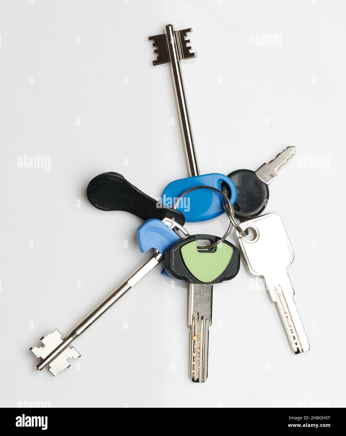 Set of different keys on ring isolated on studio background Stock Photo ...