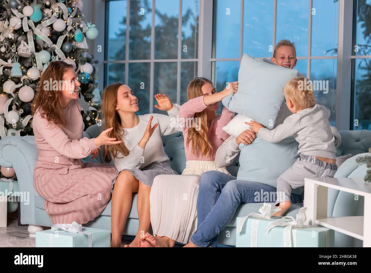 Big Happy family with many kids having fun and pillow fight under the ...