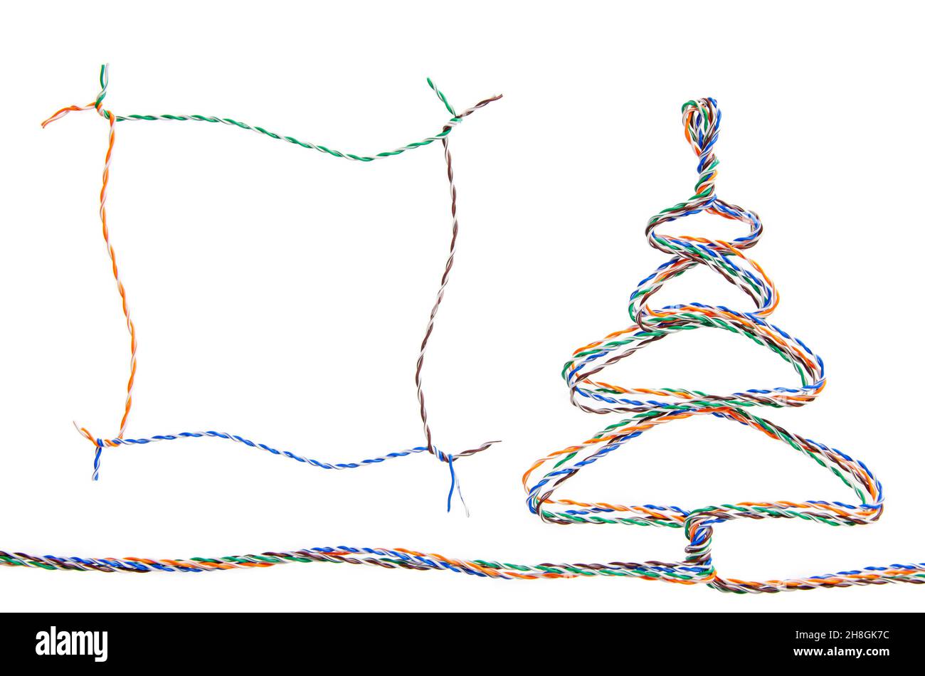 Christmas tree with frame made of twisted pair wires on white ...