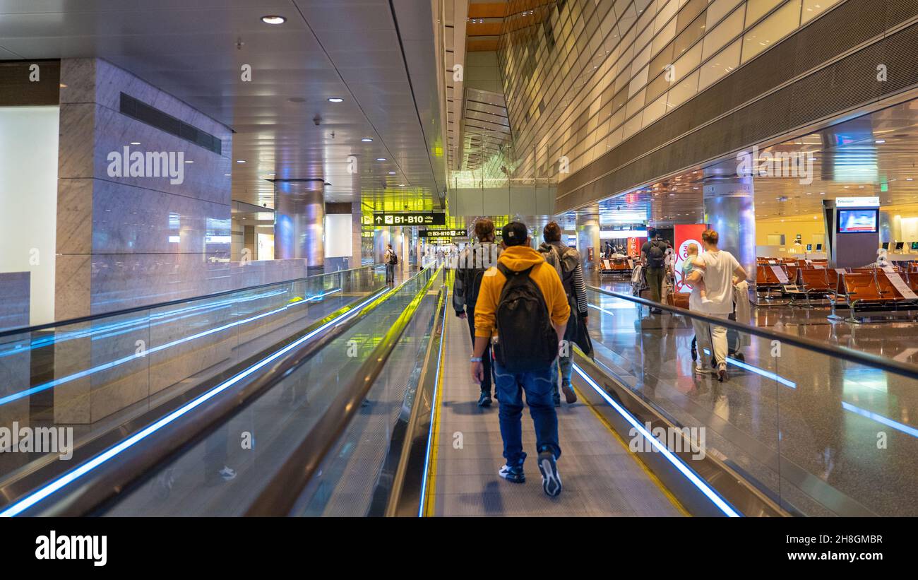 DOHA, QATAR - November 16, 2021 : Many travelers in the Hamad ...