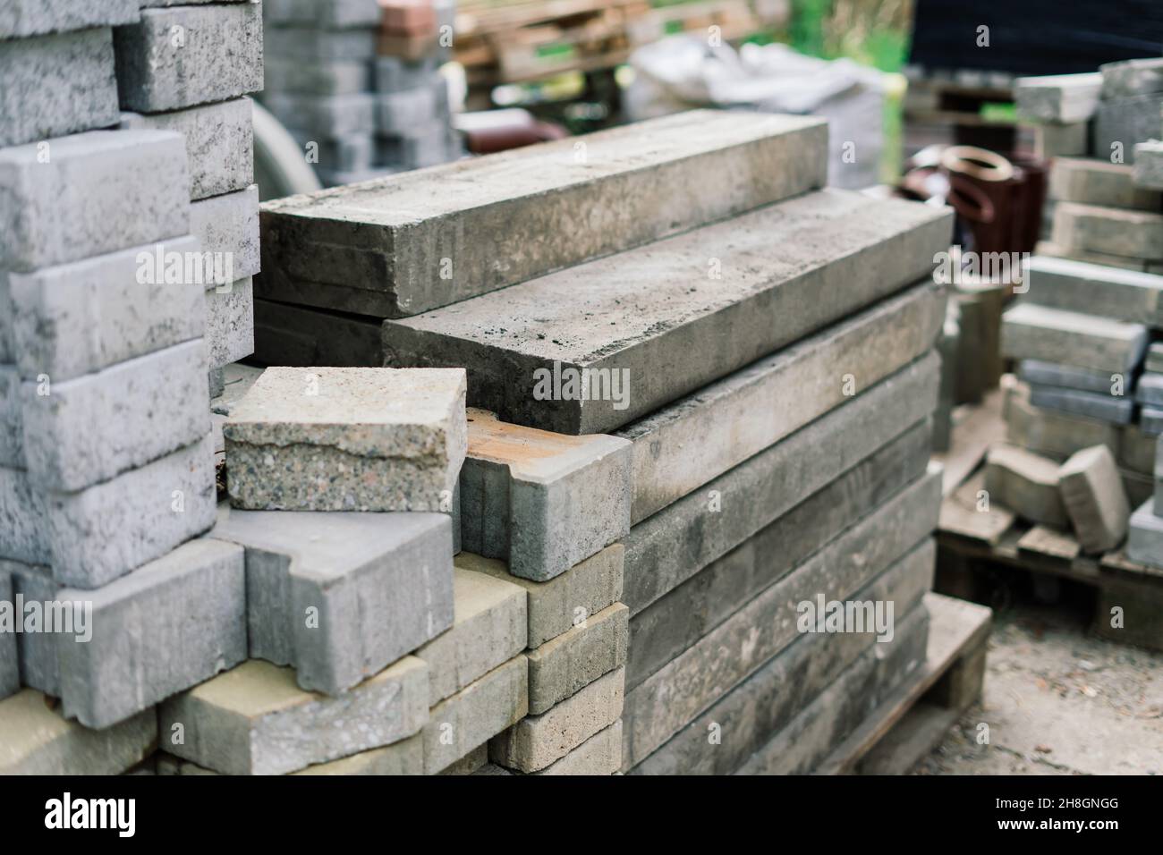 Large sectional sewer pipes, bricks, paves in a warehouse construction ...