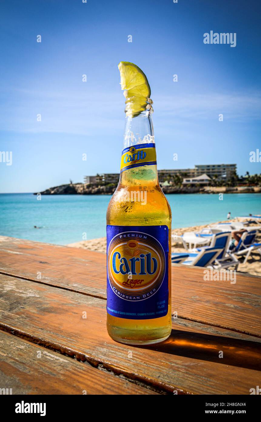 A refreshing beer sits by the beach Stock Photo - Alamy