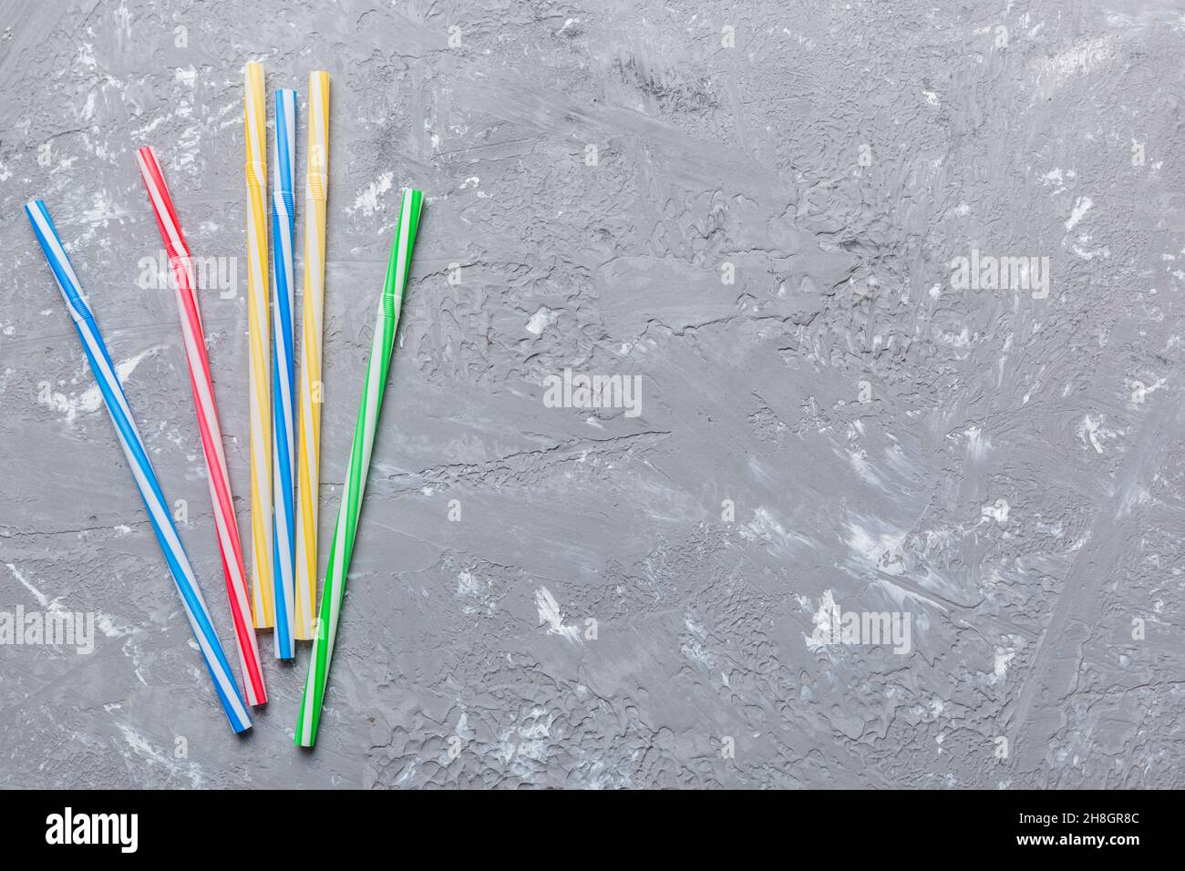 Drinking straws for party on Colored background. Top view of colorful ...