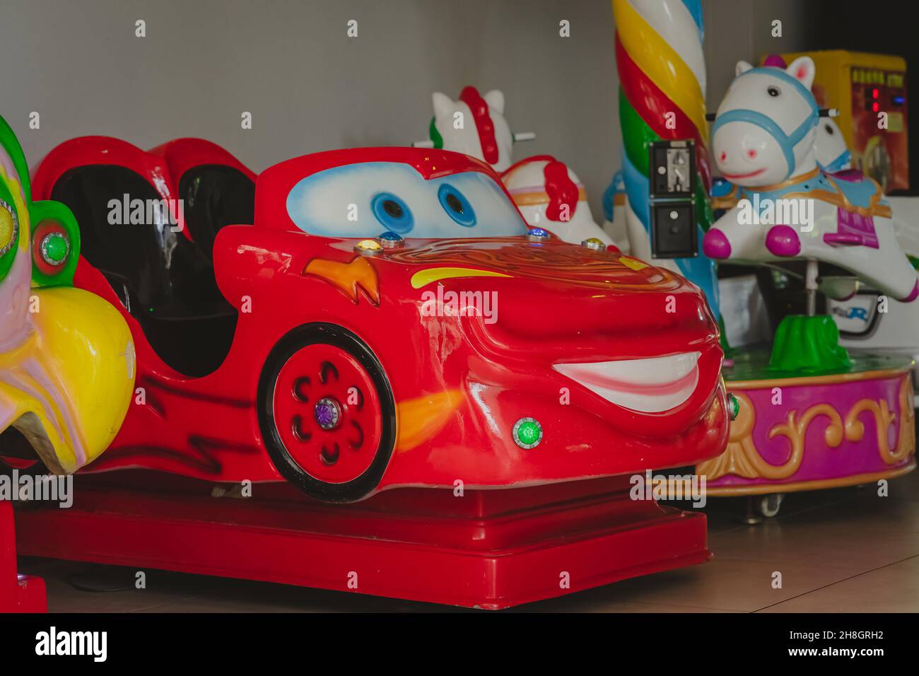 Kuala Lumpur, Malaysia - Nov 19, 2021 A coin operated kiddie ride Cars ...