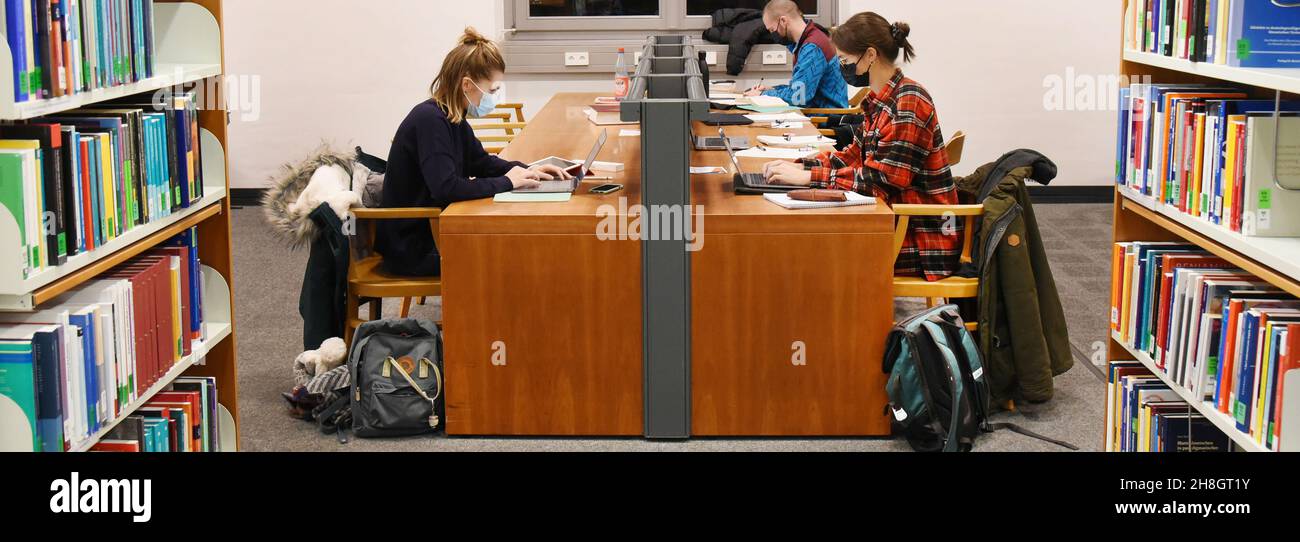 Leipzig, Germany. 26th Nov, 2021. In the university library, students ...