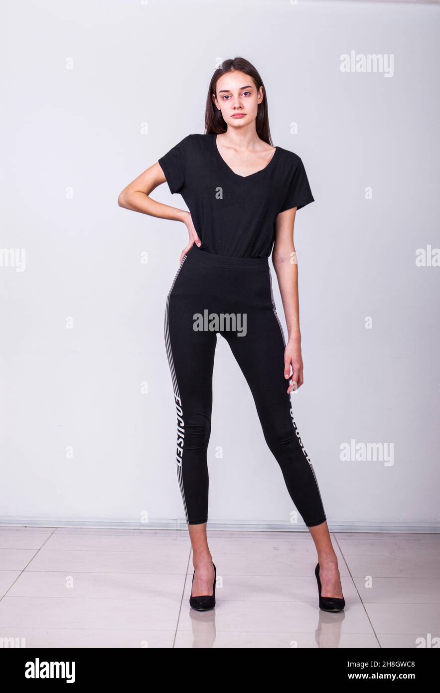 Full body portrait of a young beautiful brunette model, isolated on ...