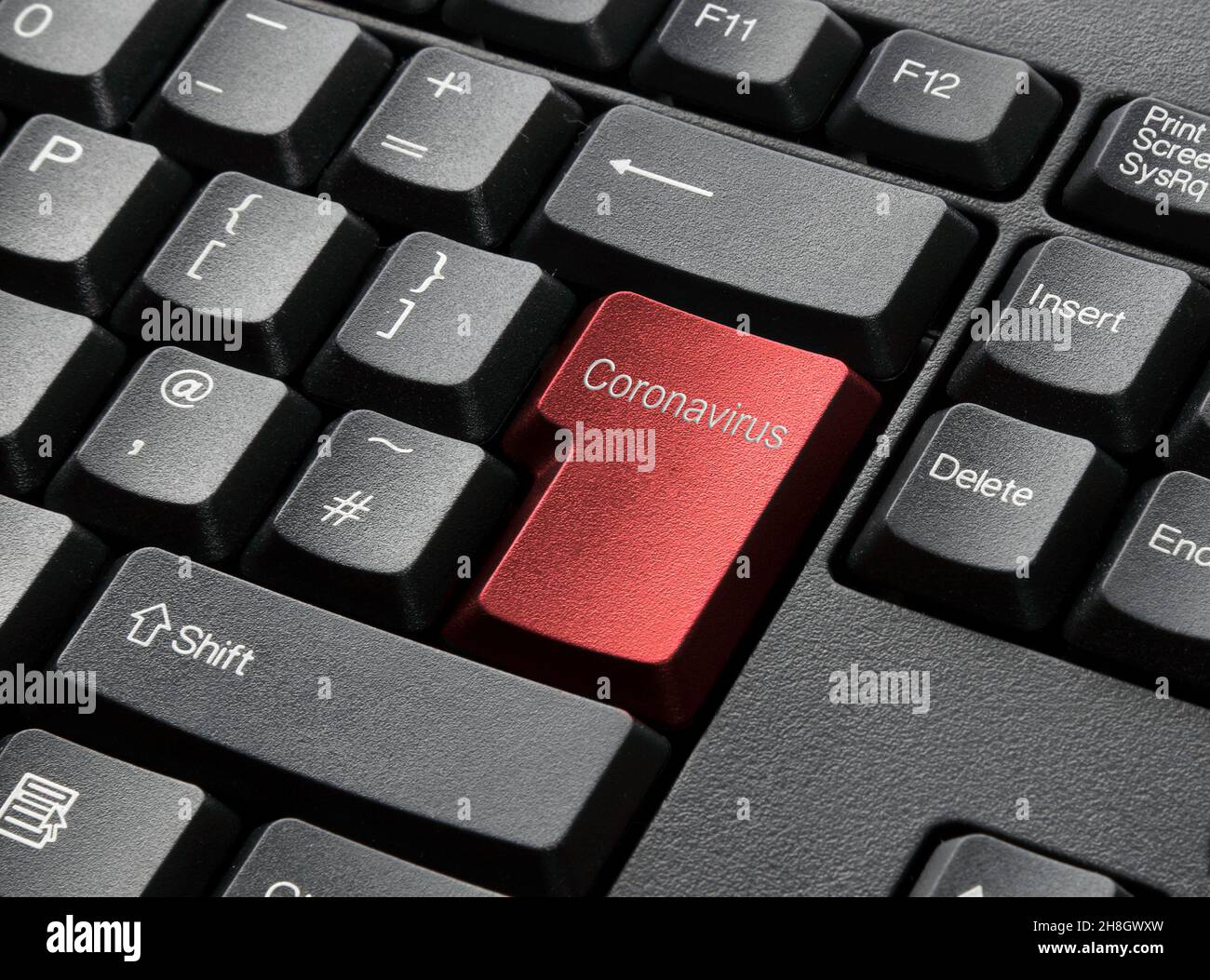 A Modern Black Computer Keyboard With Return Key Coloured Red With Text ...