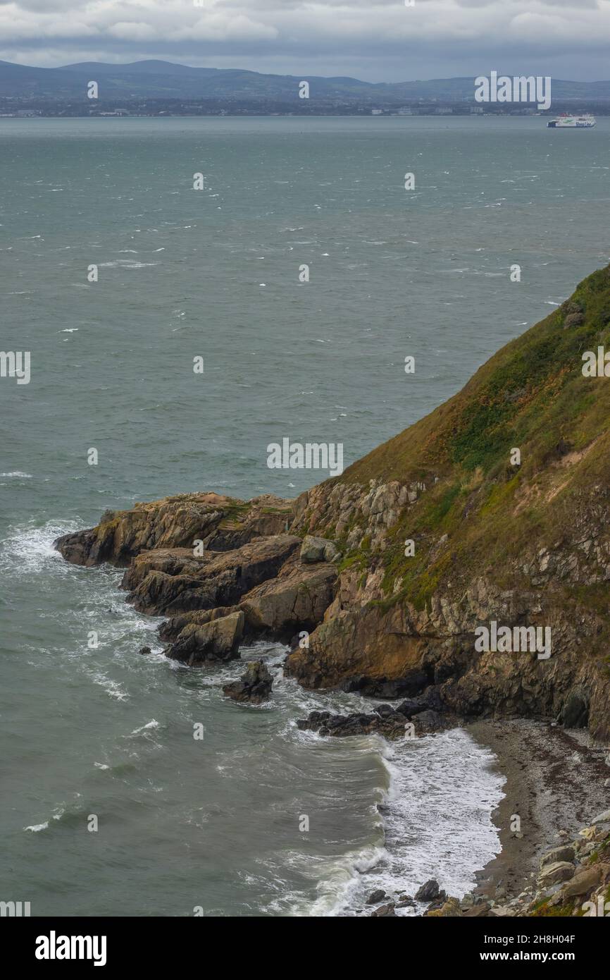 The Peninsula of Howth Head in sunny and cloudy day, hidden bay ...