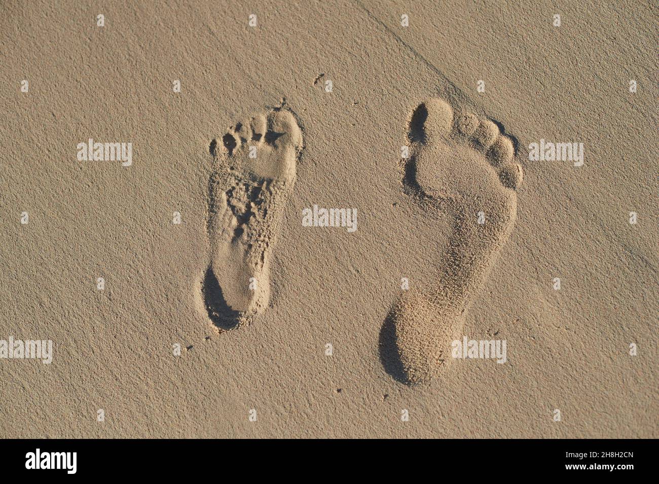 Sand beach with foot prints hi-res stock photography and images - Alamy