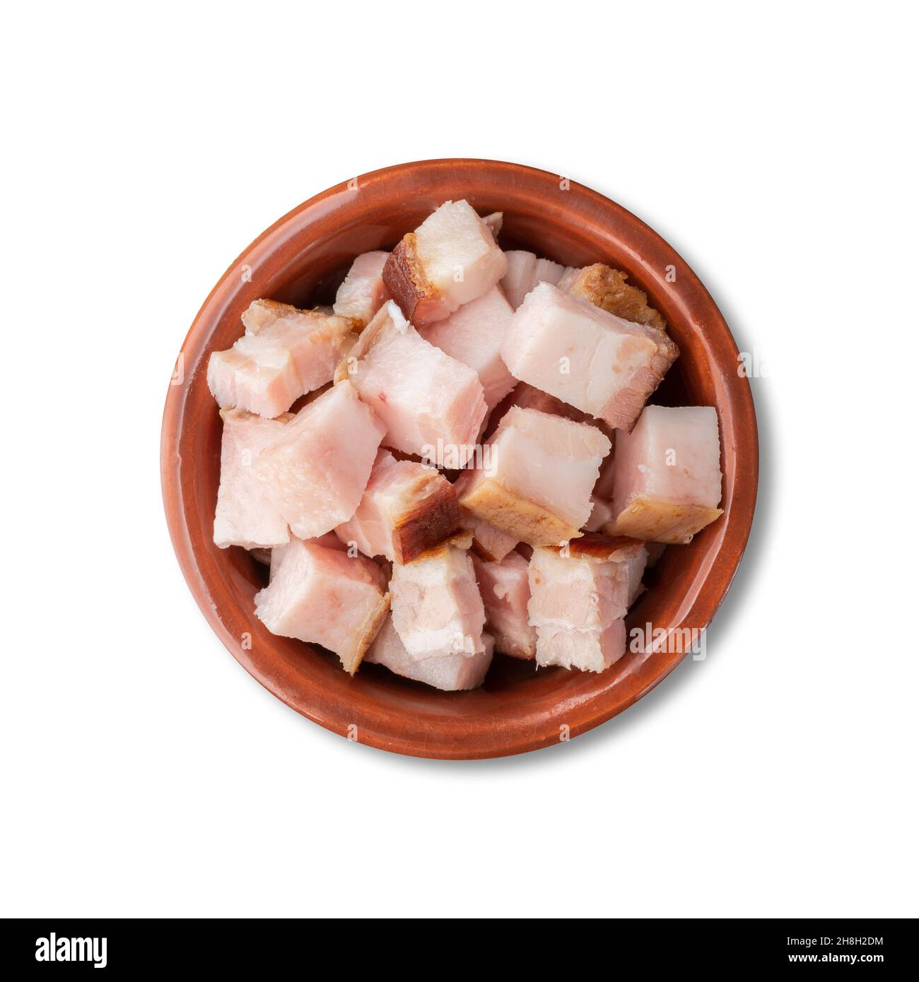 Smoked bacon cubes in a bowl isolated over white background Stock Photo ...