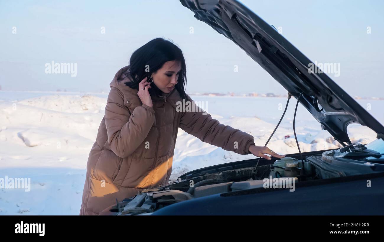 Upset woman looks broken auto hi-res stock photography and images - Alamy