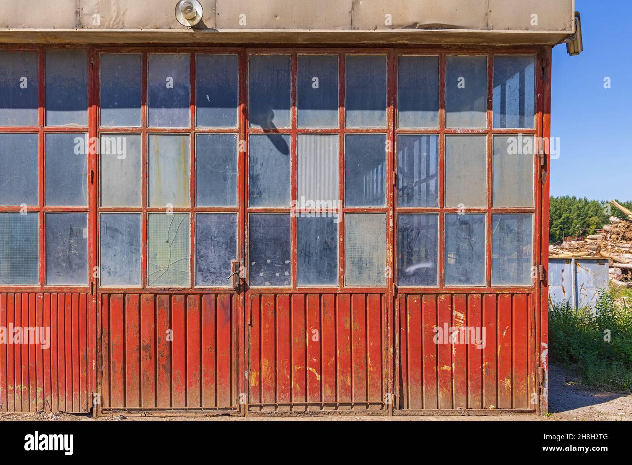 Closed Doors at Old Workshop With Dirty Windows Stock Photo - Alamy