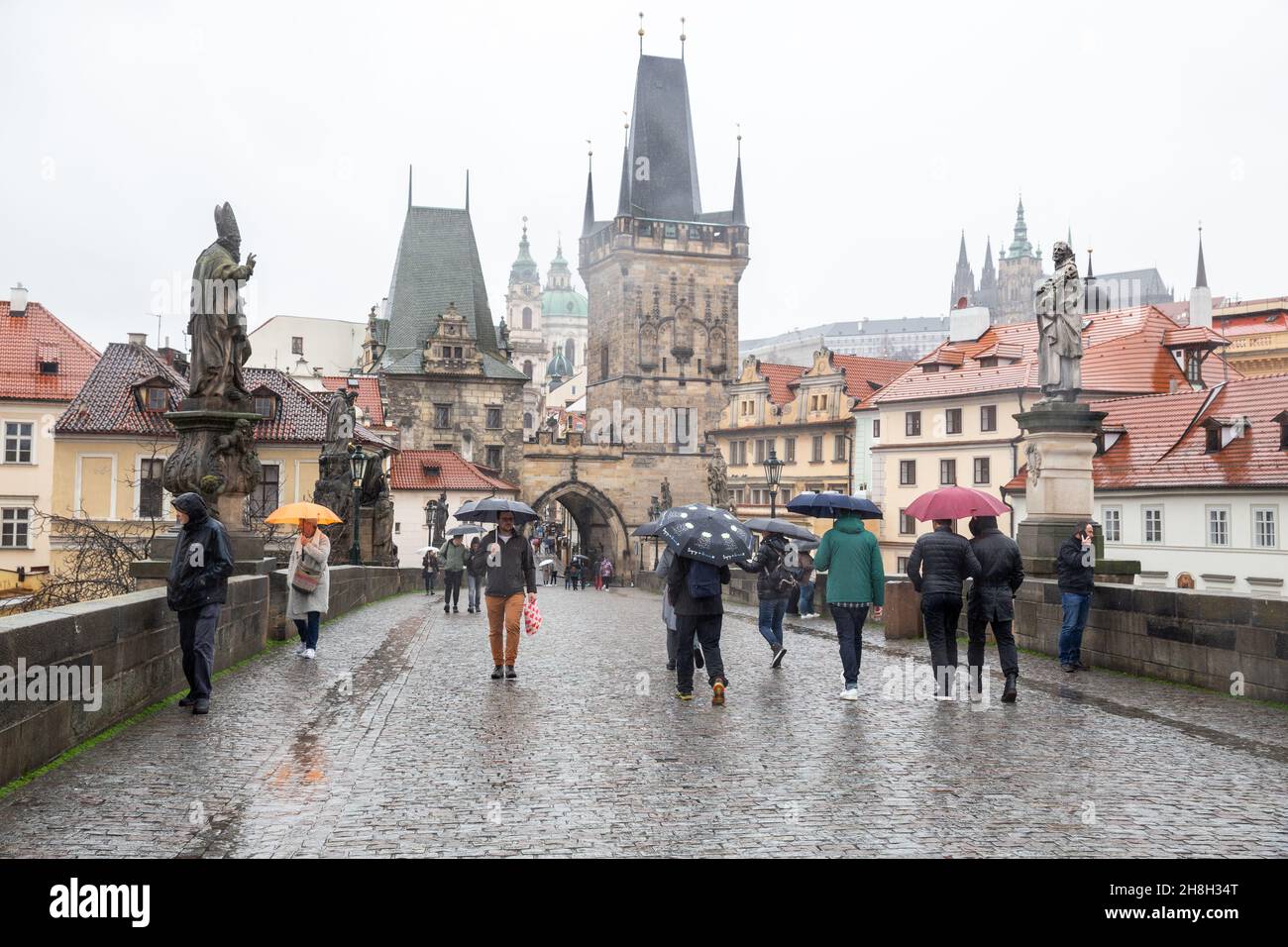 Prague - March 11, 2020: Rainy day in Prague. Tourists visit Charles ...
