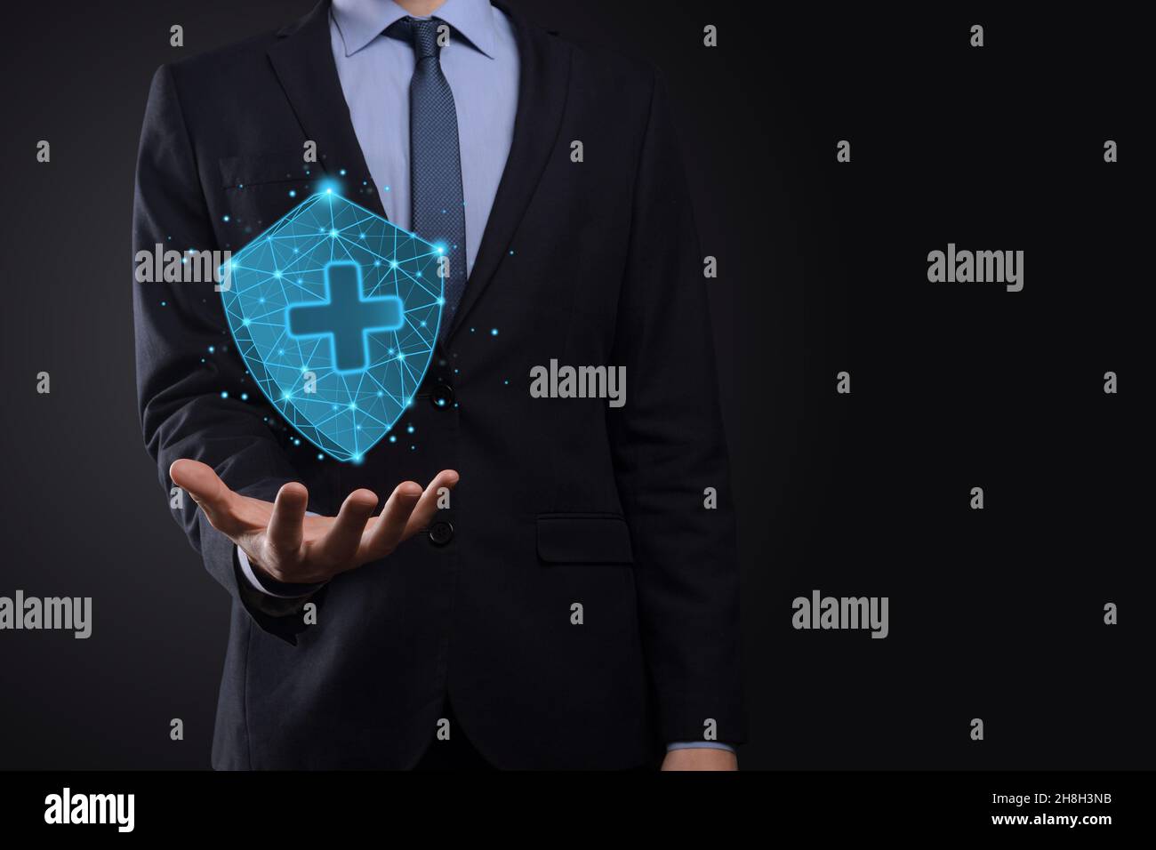 Businessman hold Shield with plus Low polygonal icon, medicine icon ...