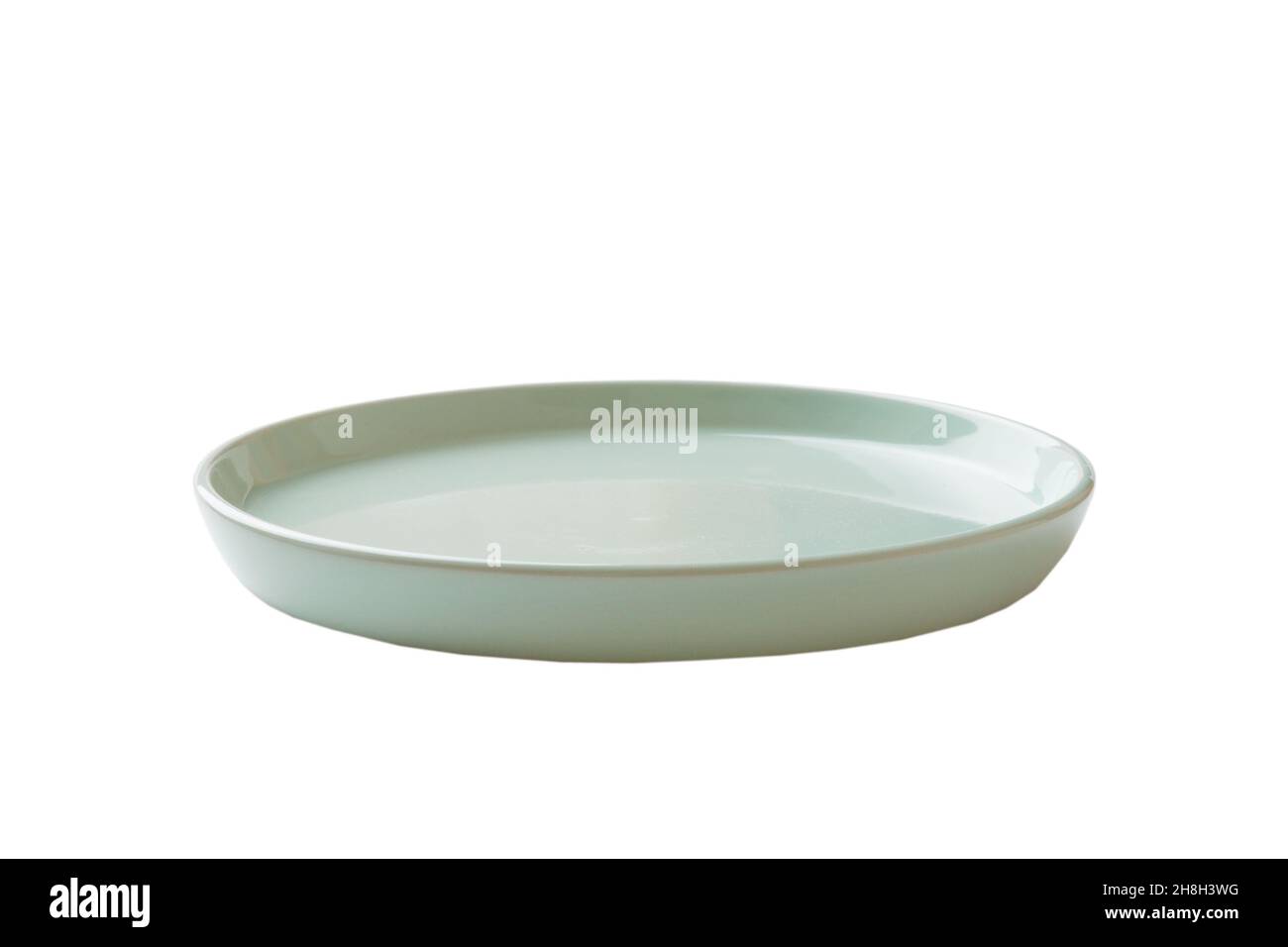 Blue ceramic round plate isolated over white background. perspective ...